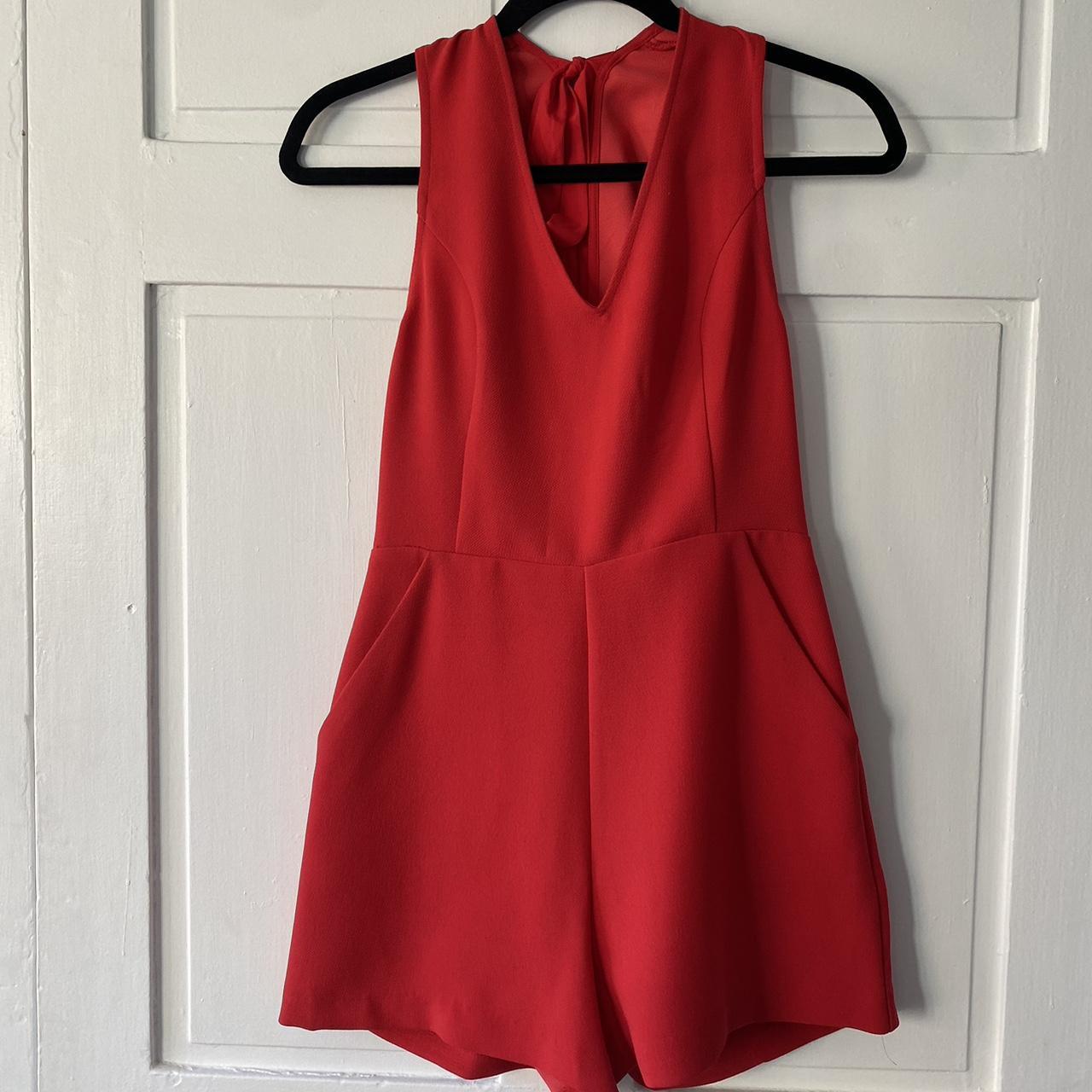BCBG red romper with pockets and tie back detail - Depop