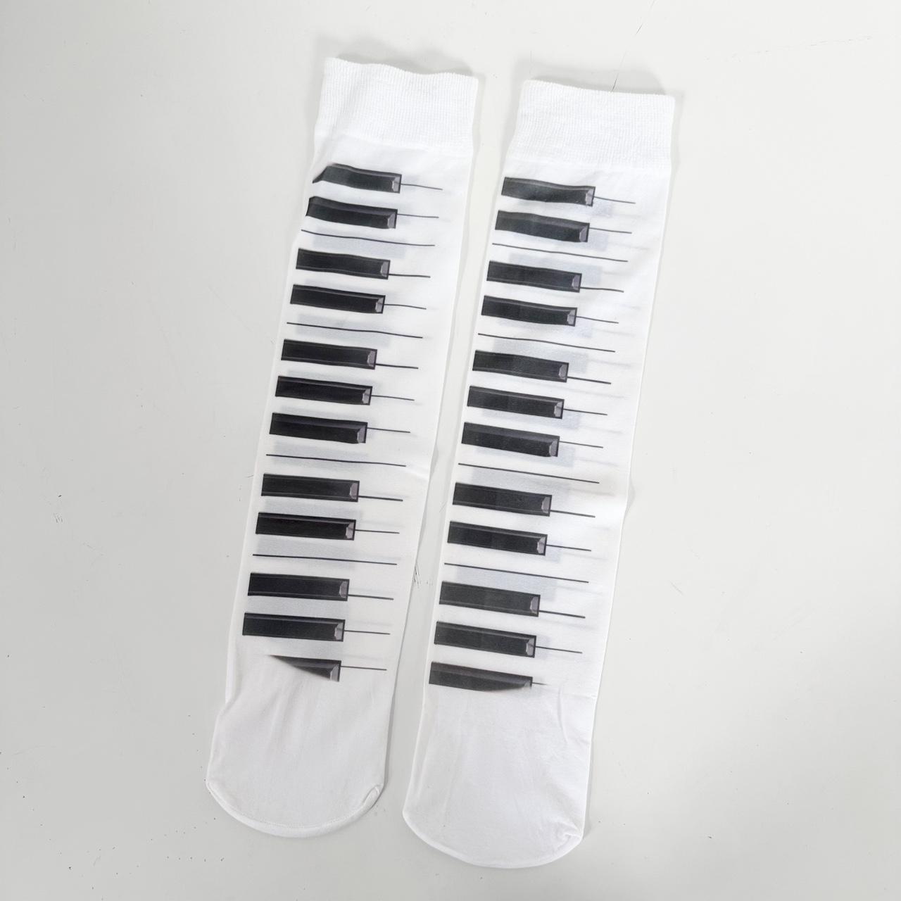 hand printed piano socks never worn, may have... | Depop