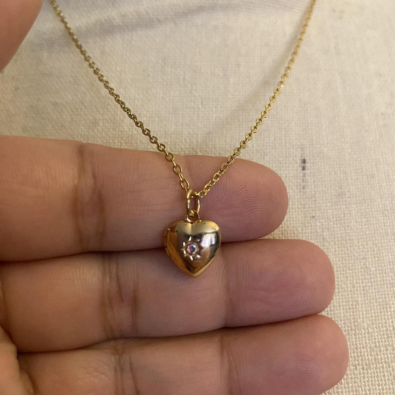 Super cute tiny gold heart locket with white diamond... - Depop