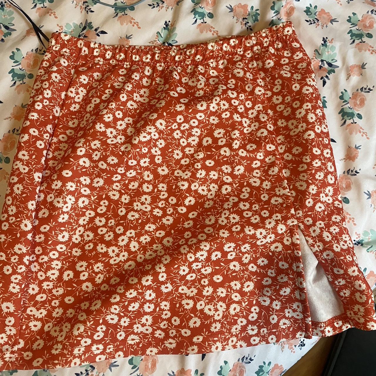 Mini orange flower skirt! No tags but fits like a... - Depop