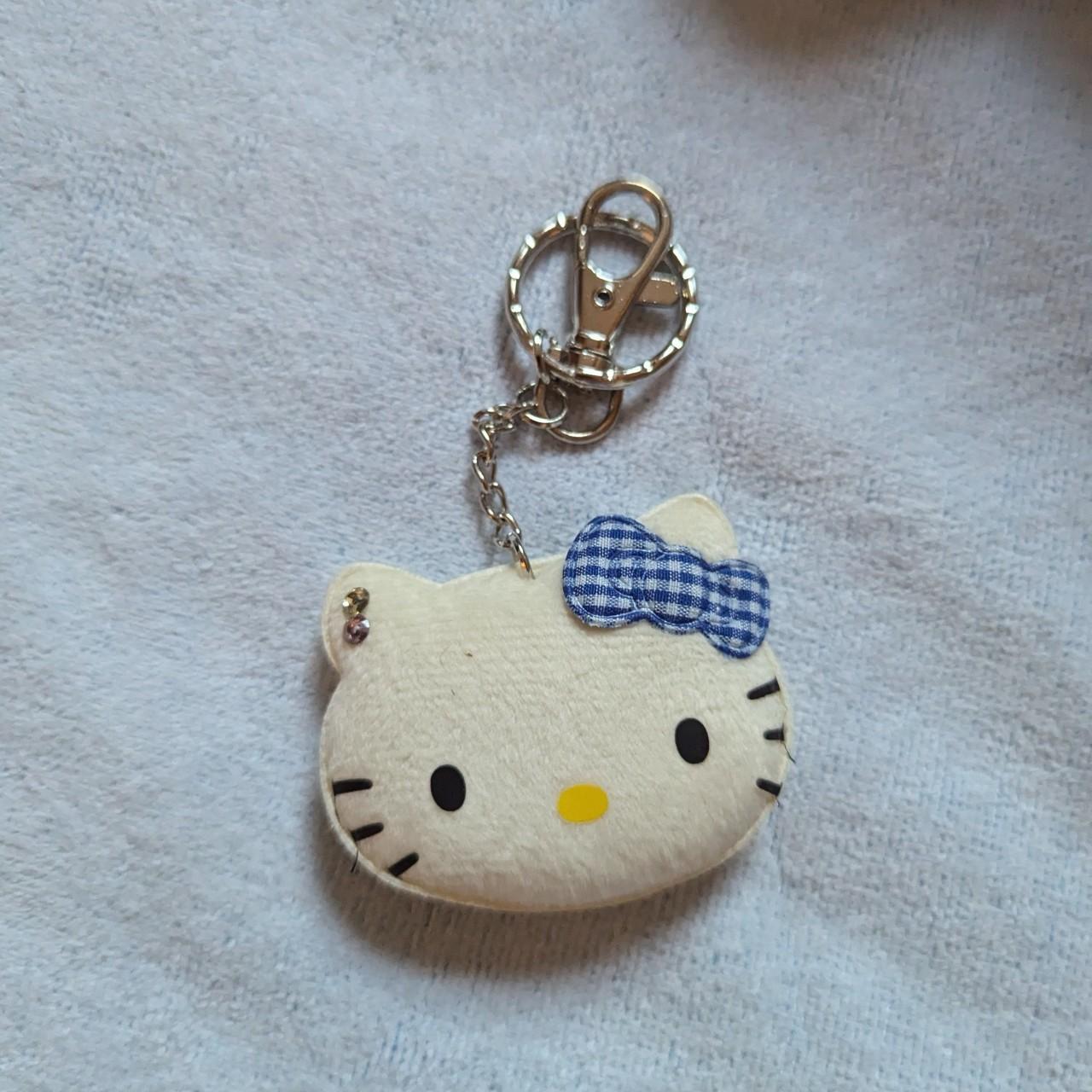 Hello Kitty head keychain with a blue... | Depop