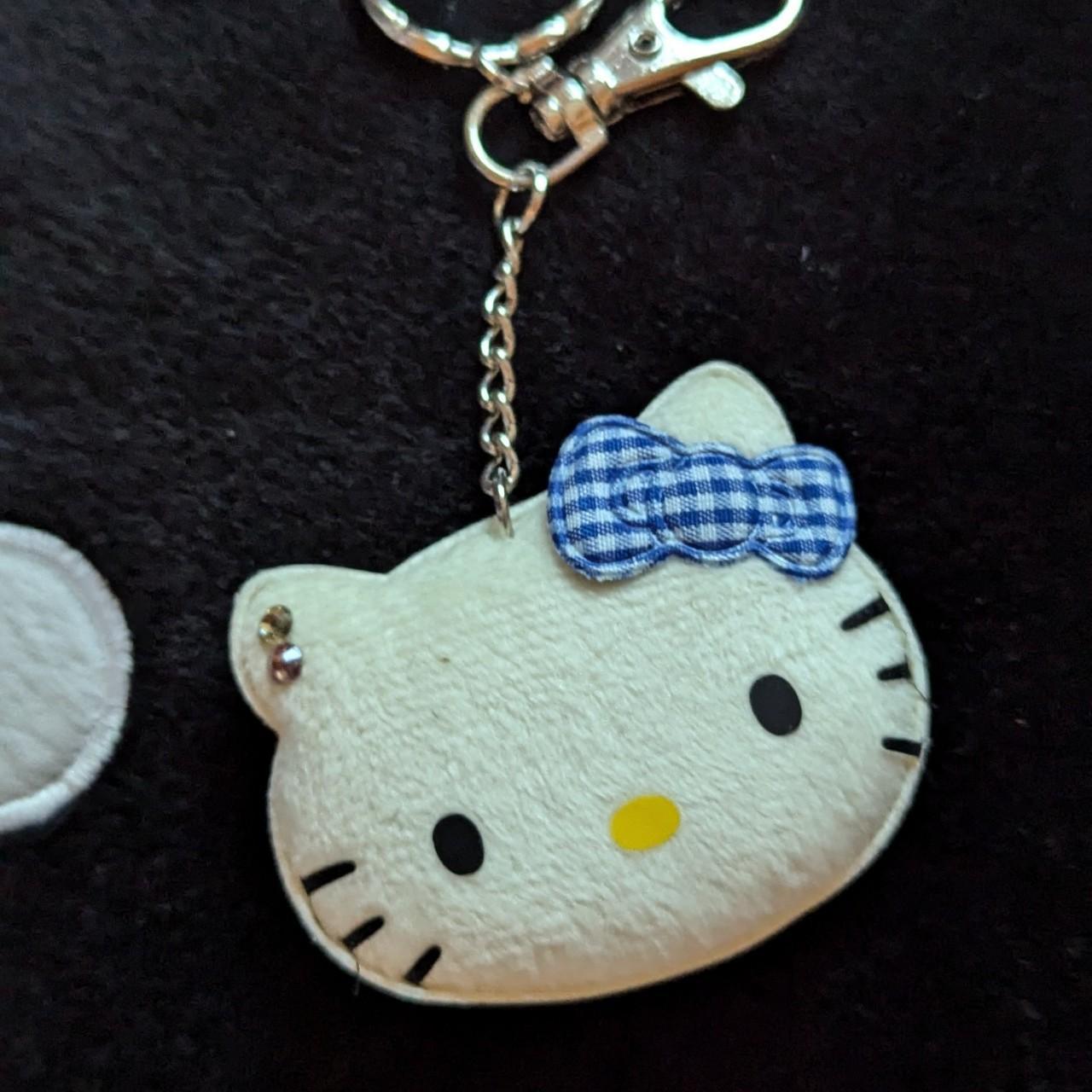 Hello Kitty head keychain with a blue... | Depop