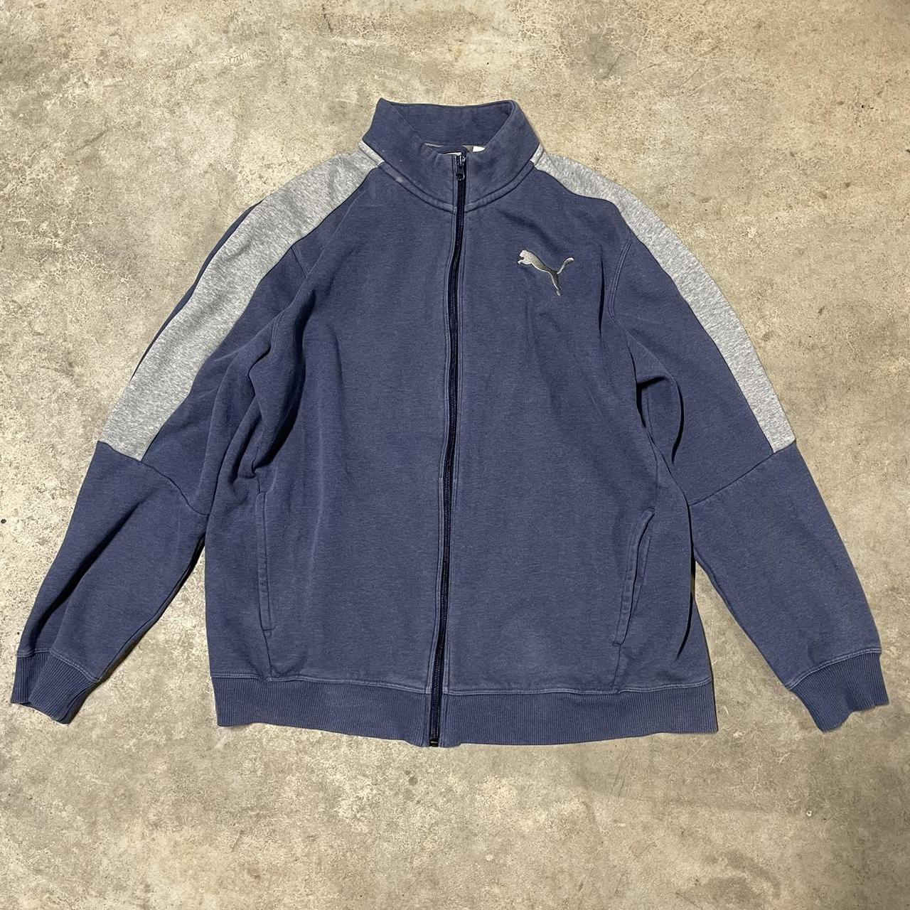Blue Puma track suit type zip up with grey accents... - Depop