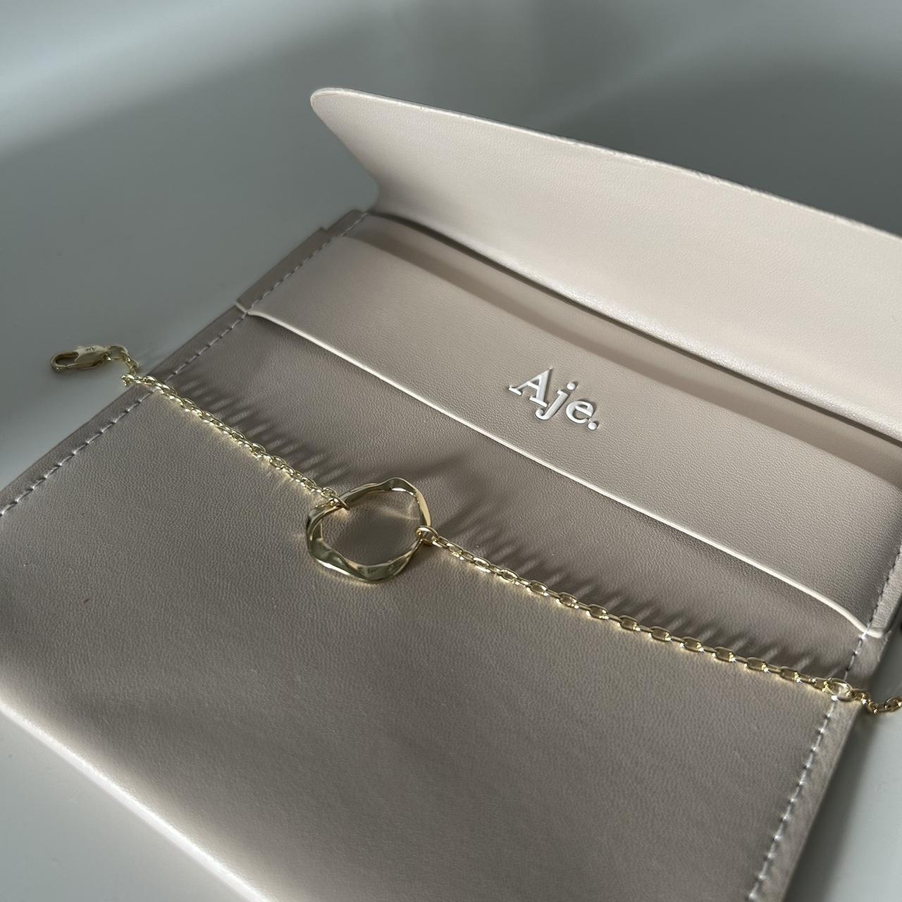 Aje gold chain bracelet - brand new with bag - Depop