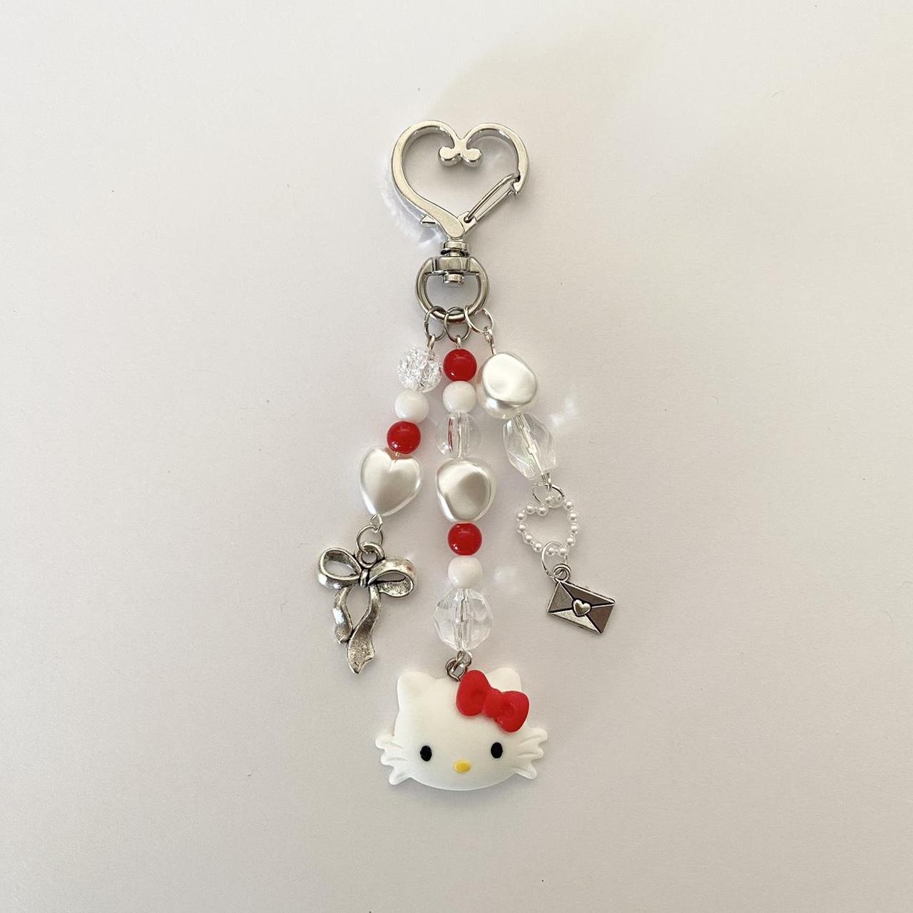 red & white hello kitty keychain ♡ has a bow charm,... - Depop