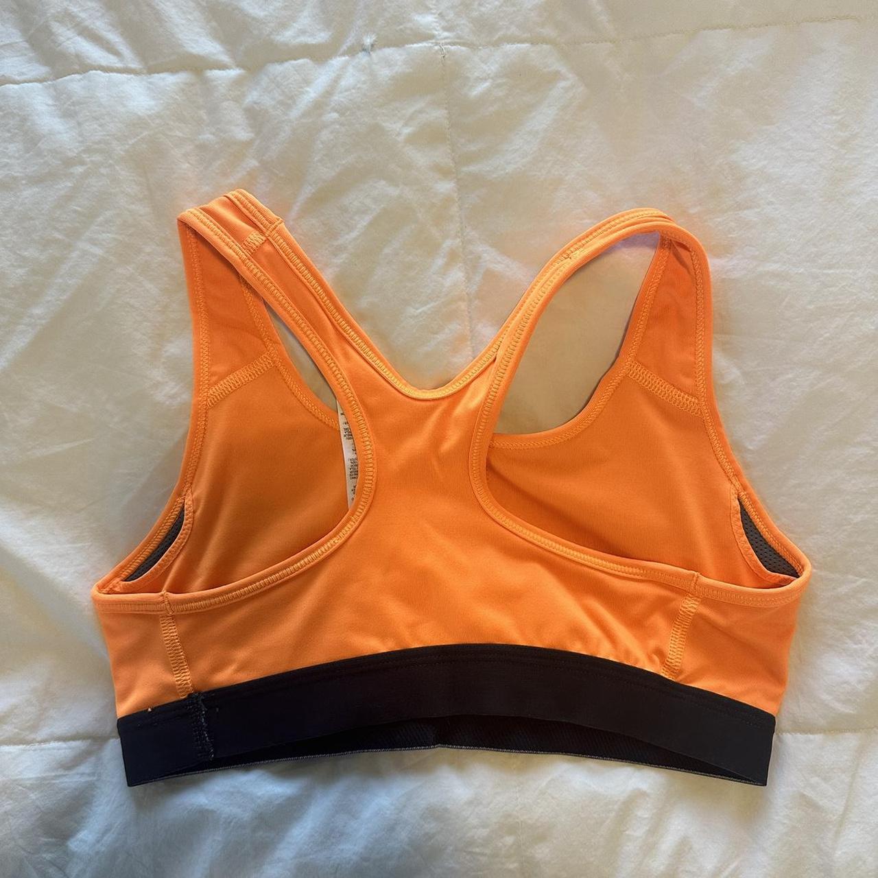 Neon orange Nike sports bra. No padding included but... - Depop