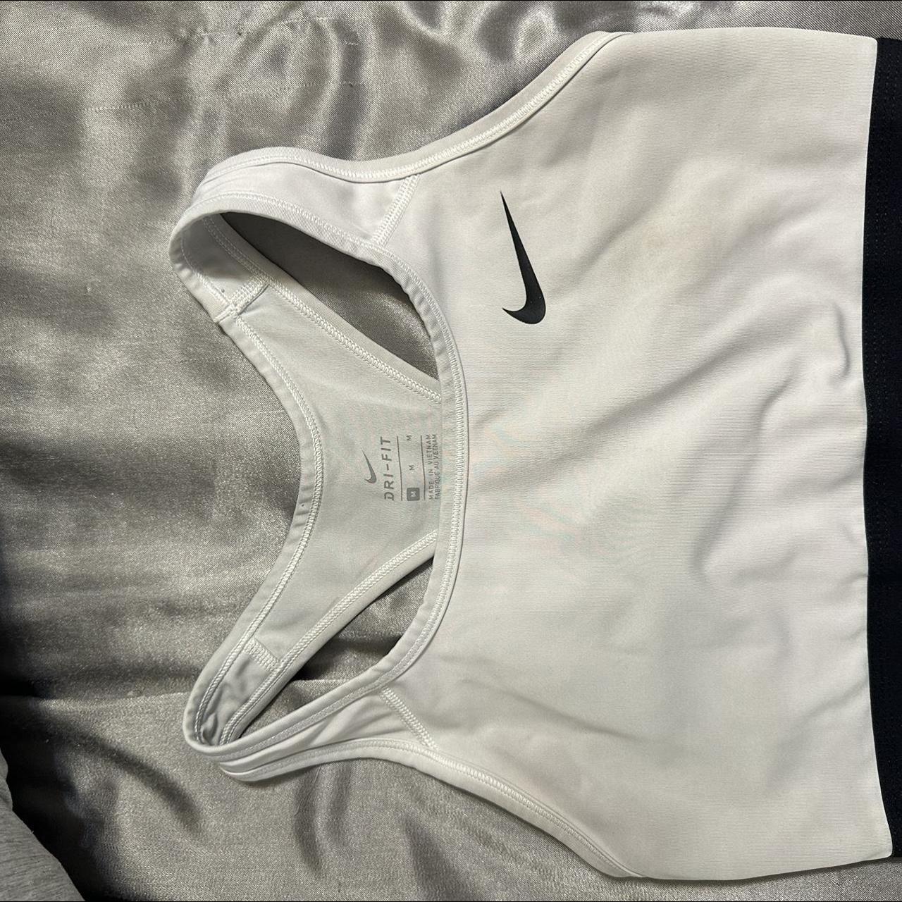 white nike sports bra women’s medium slight stain on... - Depop