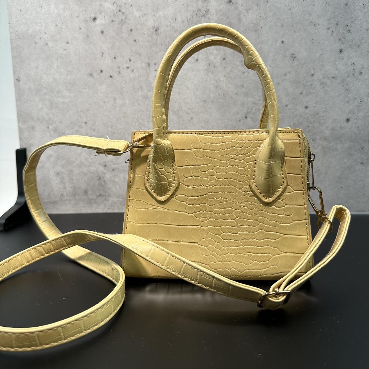 Yellow little handbag! Small tear in handle. Great... - Depop