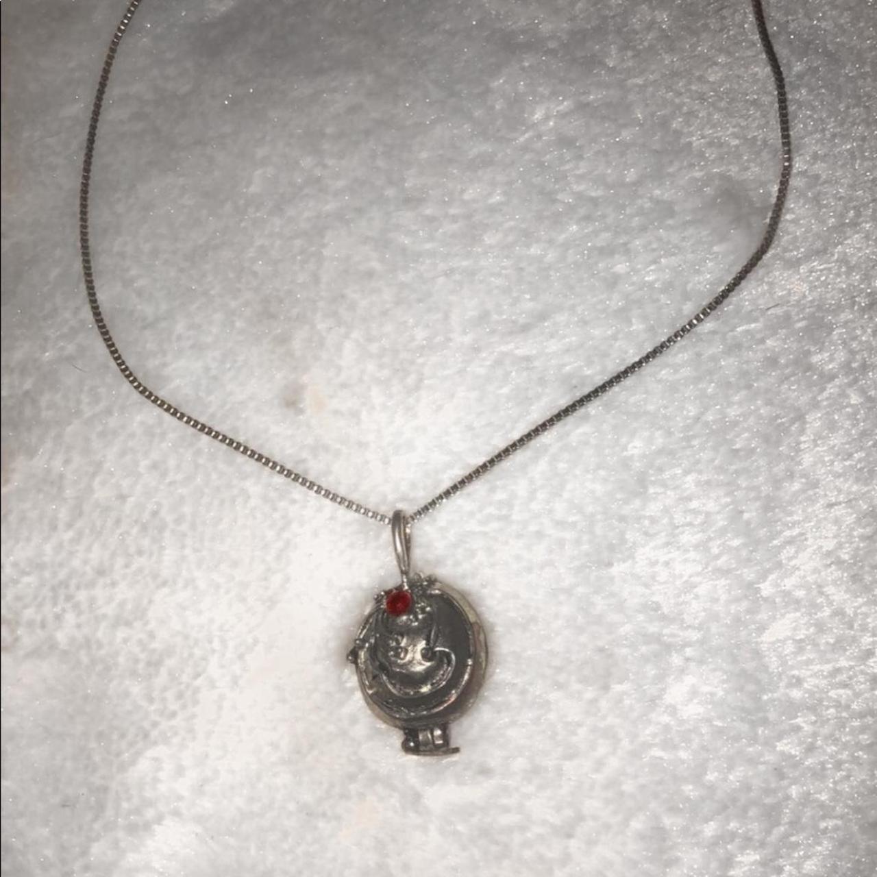 The vampire diaries locket. Silver locket with red... | Depop