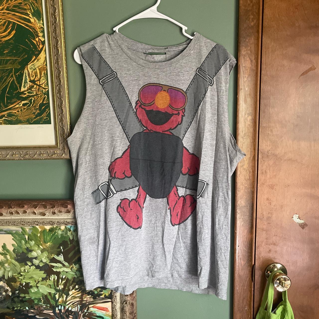vintage muscle tank with Elmo in a baby bjorn (hole... - Depop