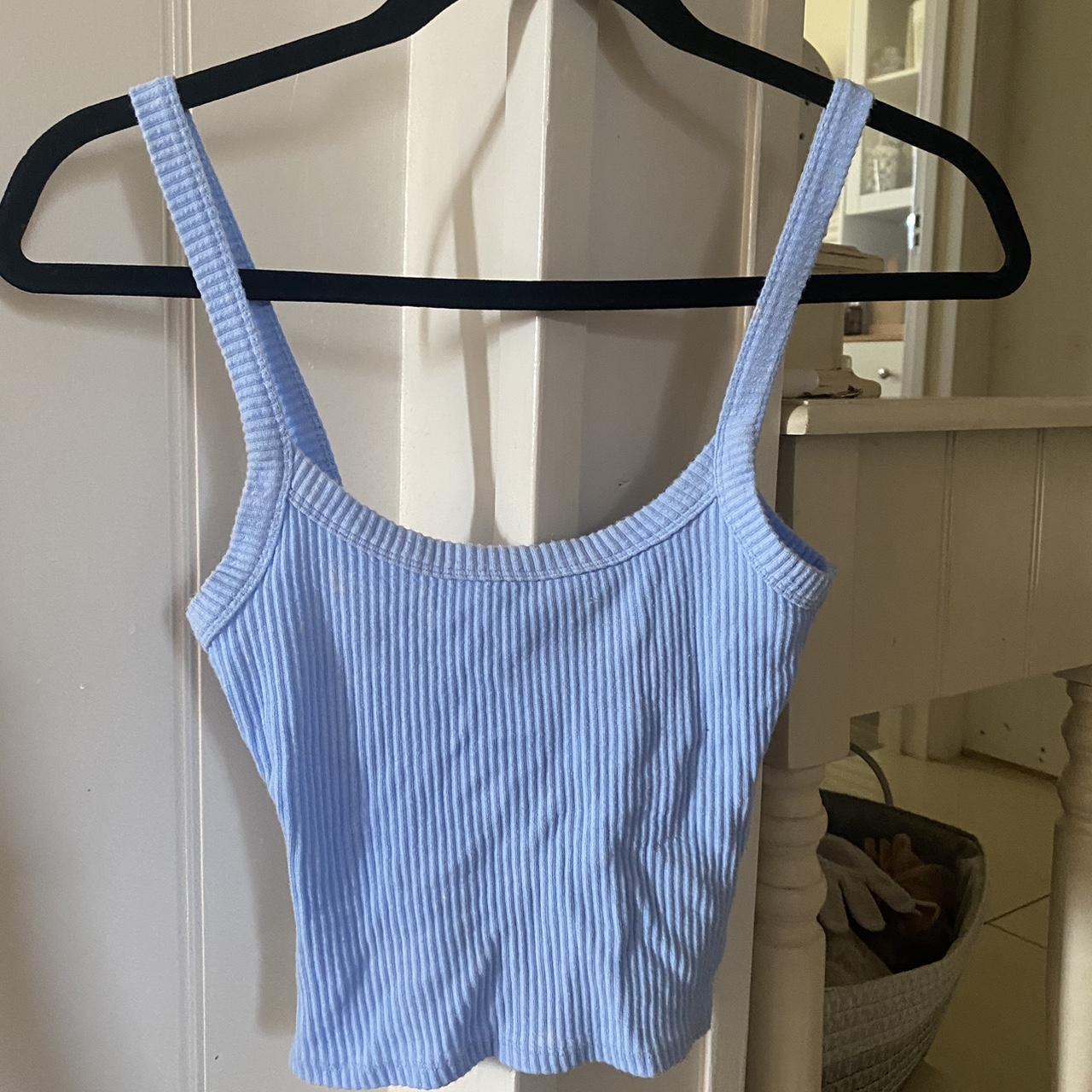 blue riri top, bleach stain which is unnoticeable - Depop