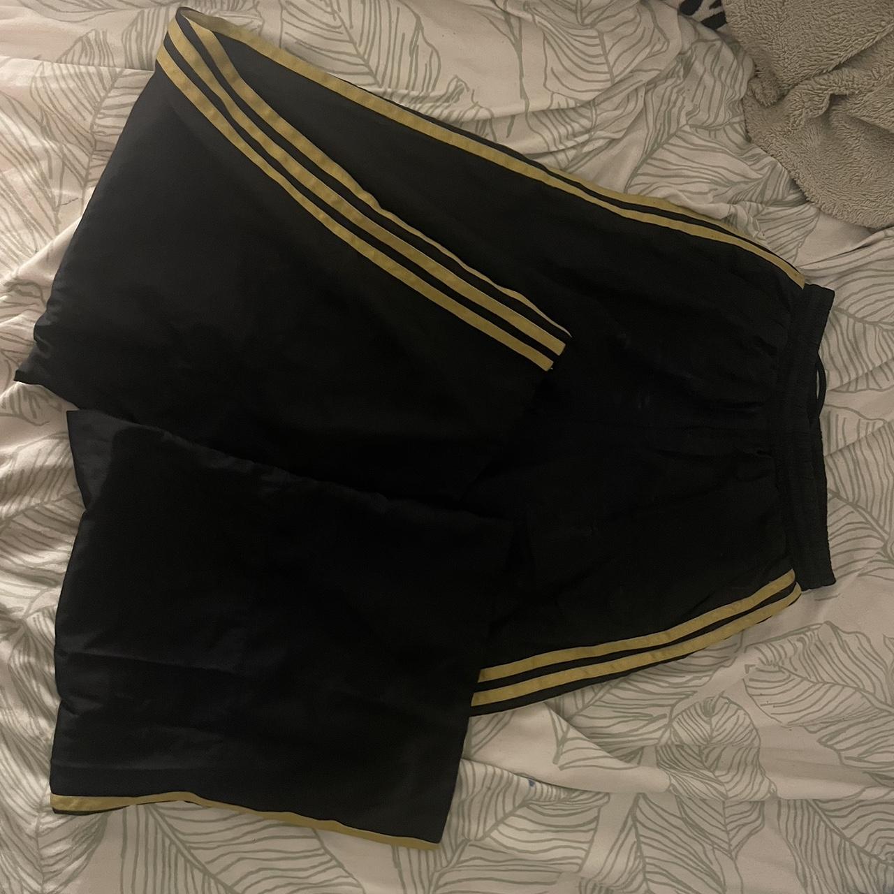 Adidas gold and black track suit bottom with very... - Depop