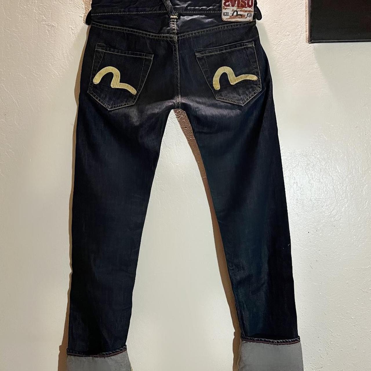 low rise, straight legged, dark washed Evisu jeans - Depop