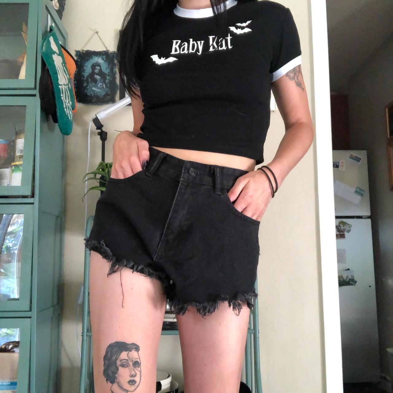 High-waisted black shorts with fire embroidered... - Depop