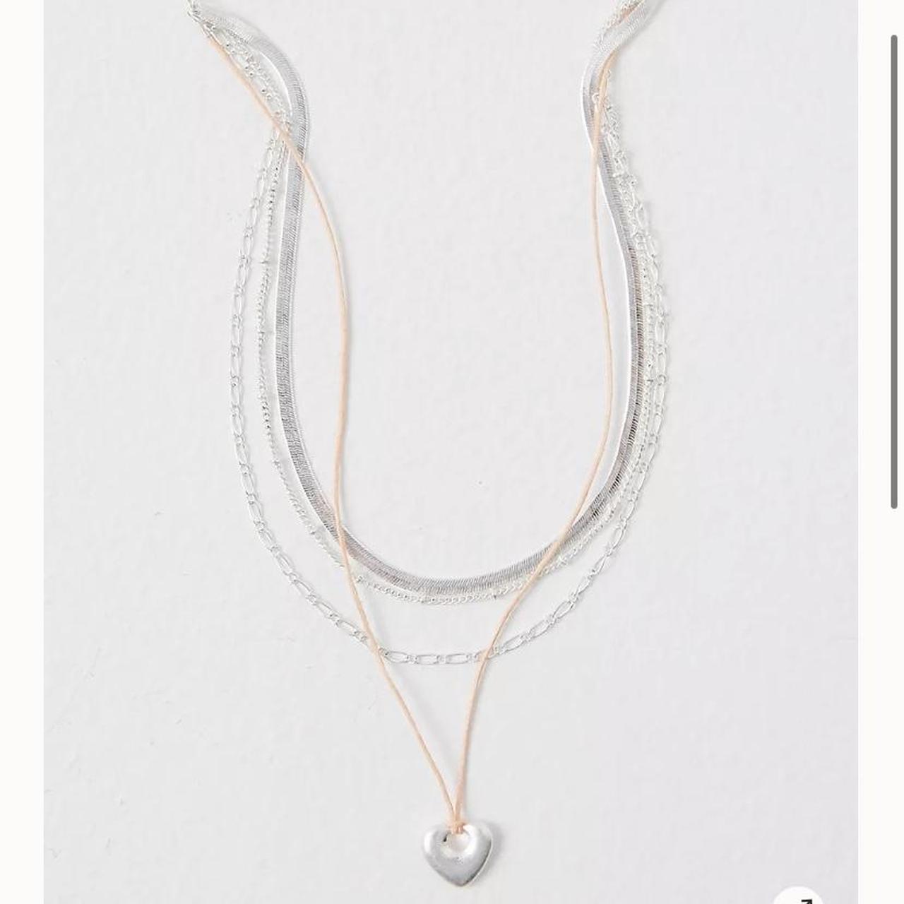 Silver layered necklace with pink string and silver... - Depop