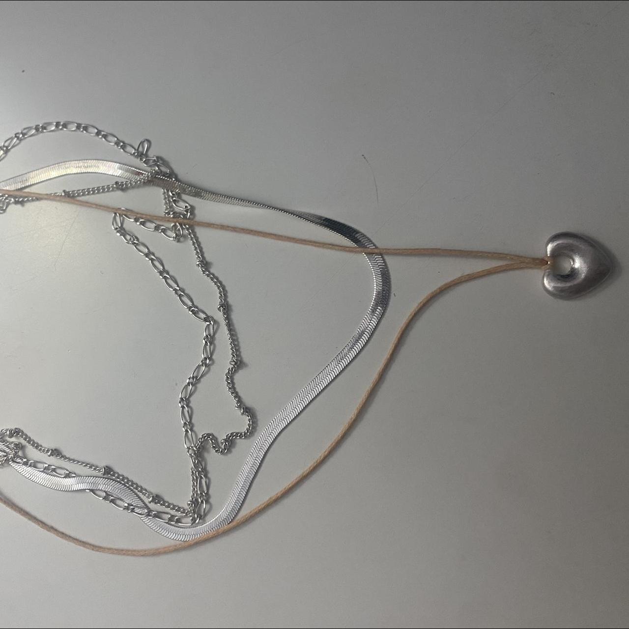 Silver layered necklace with pink string and silver... - Depop