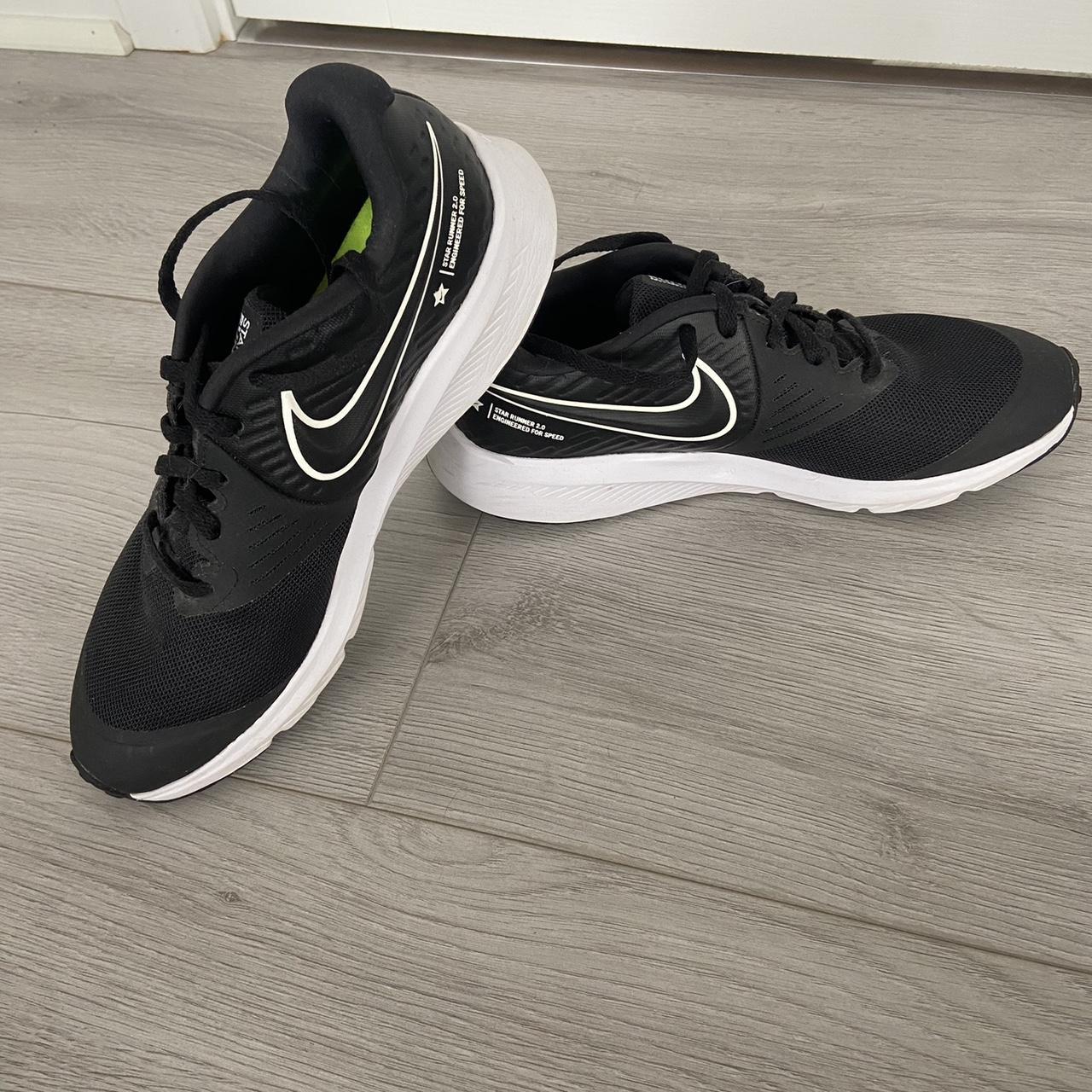 Black Nike running trainers - Depop