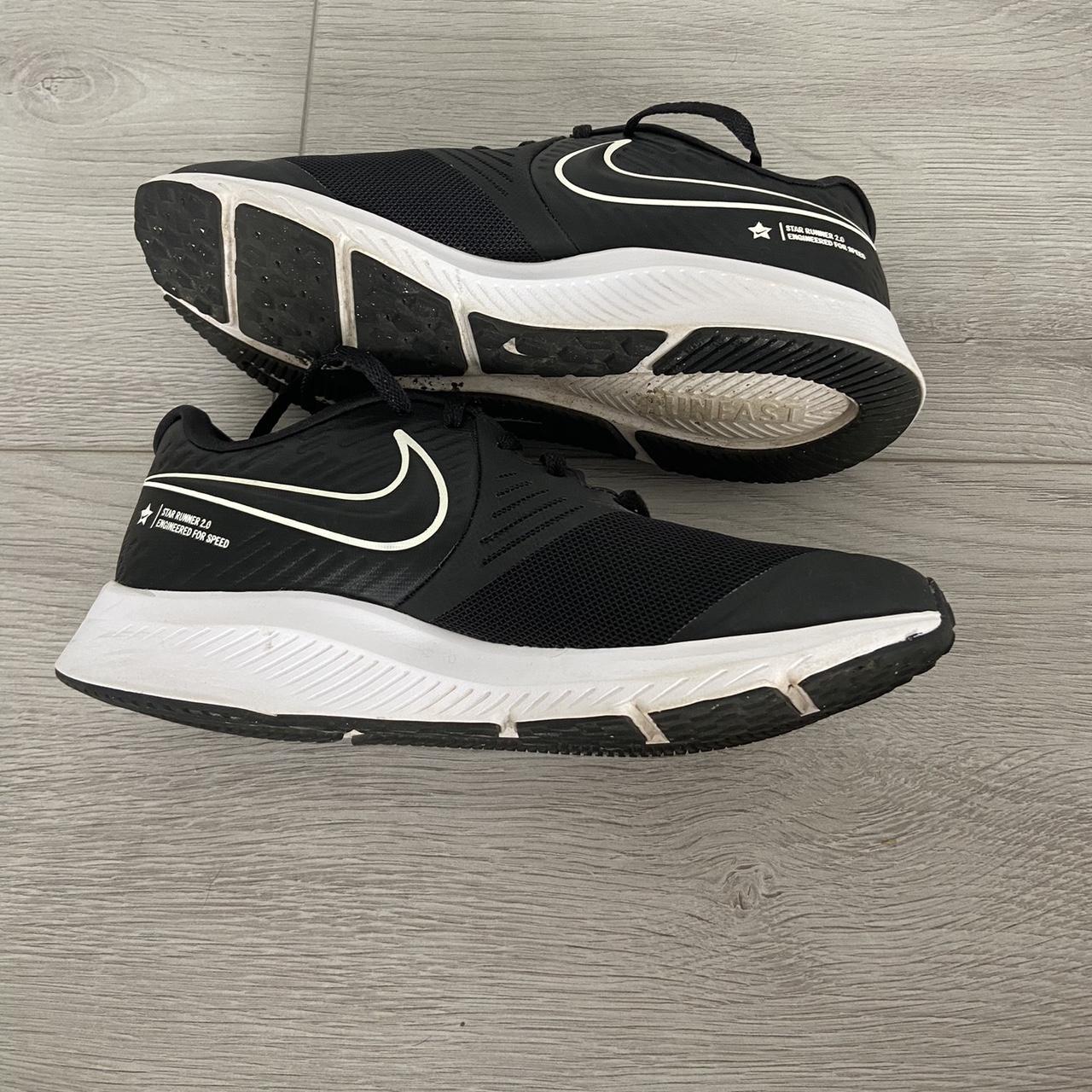 Black Nike running trainers - Depop
