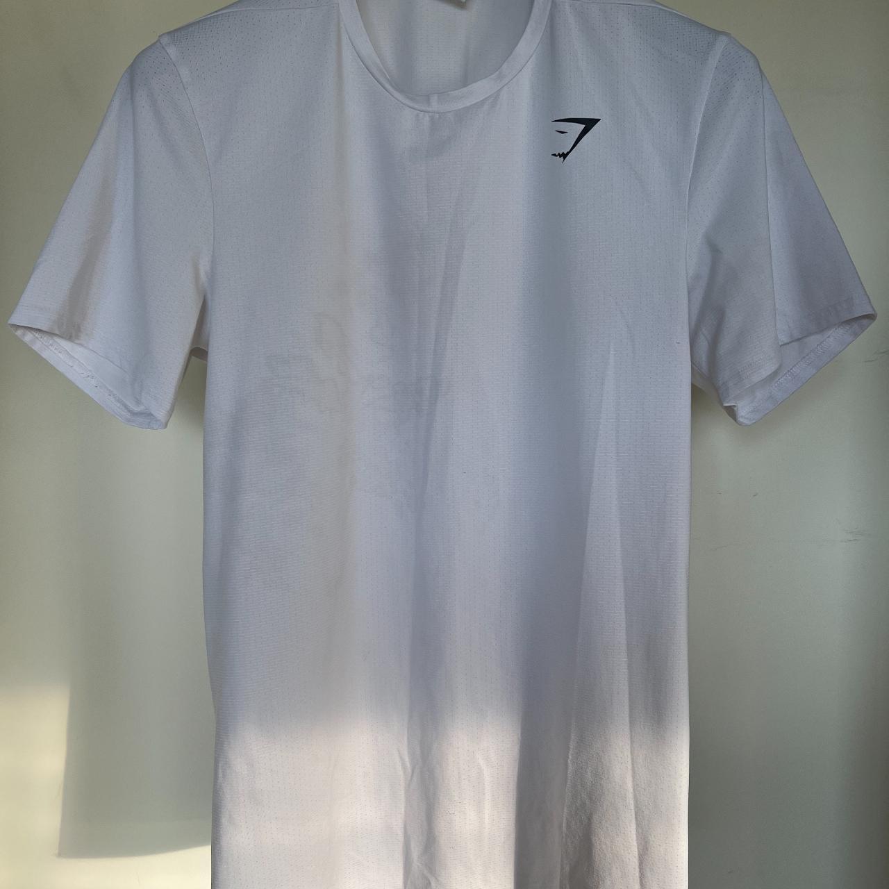 Gymshark White Basic Tee. Slight strain in the... - Depop