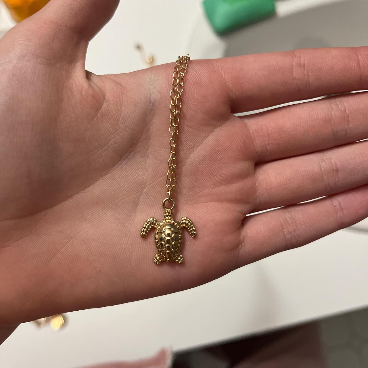 Gold necklace set featuring a turtle, spiral shell,... | Depop