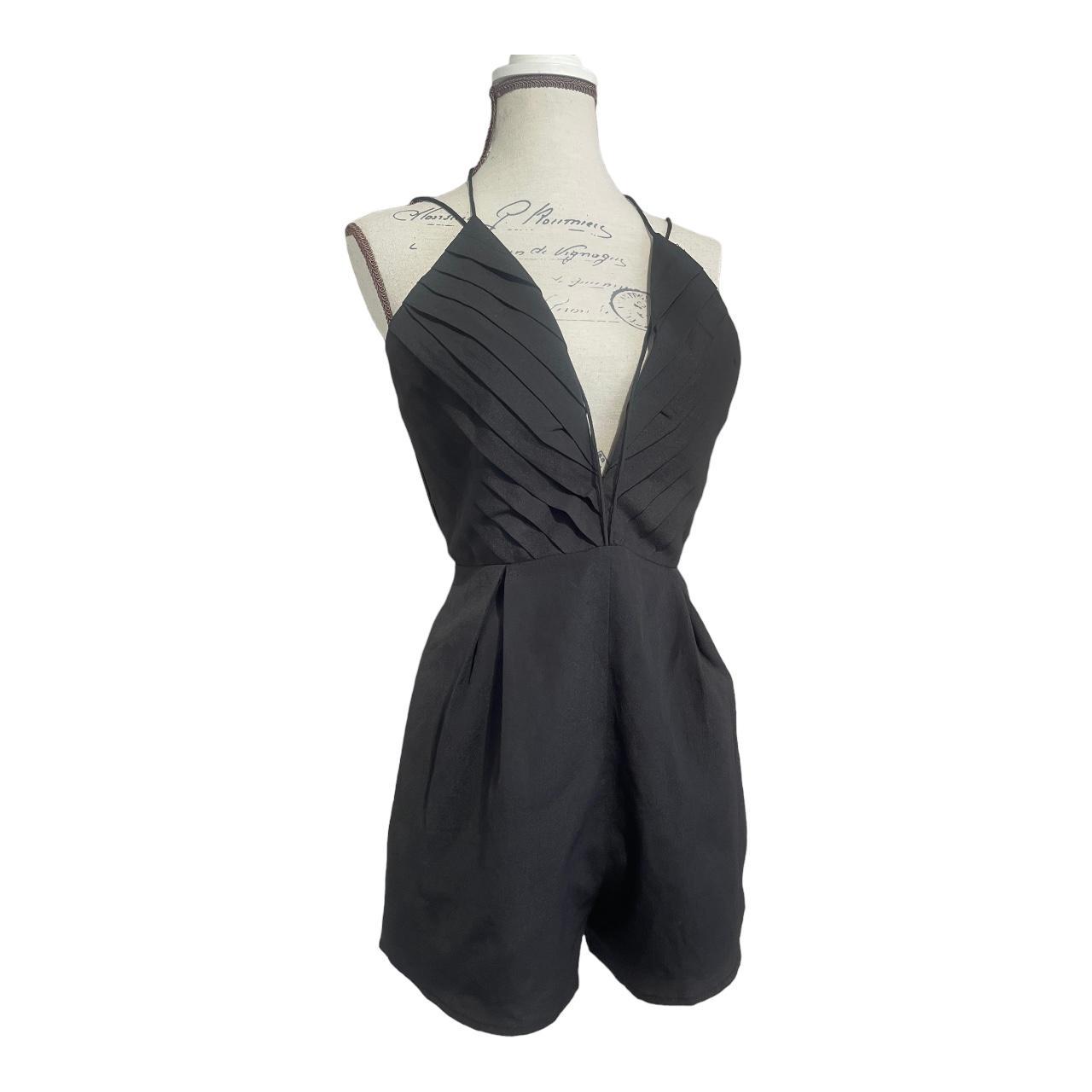 This black halter neck draped bodice playsuit is a... - Depop