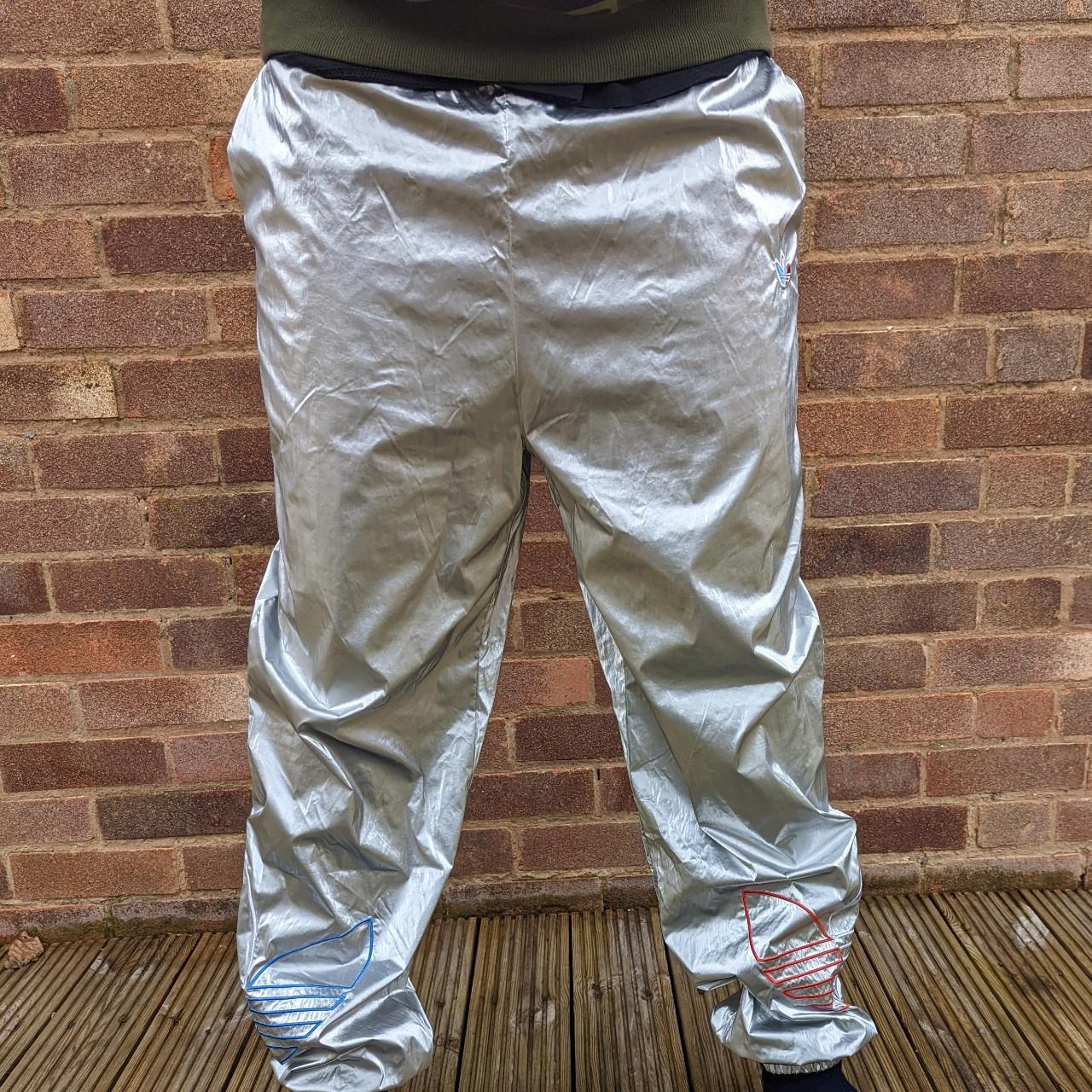 Selling these futuristic Adidas silver shiny track... - Depop