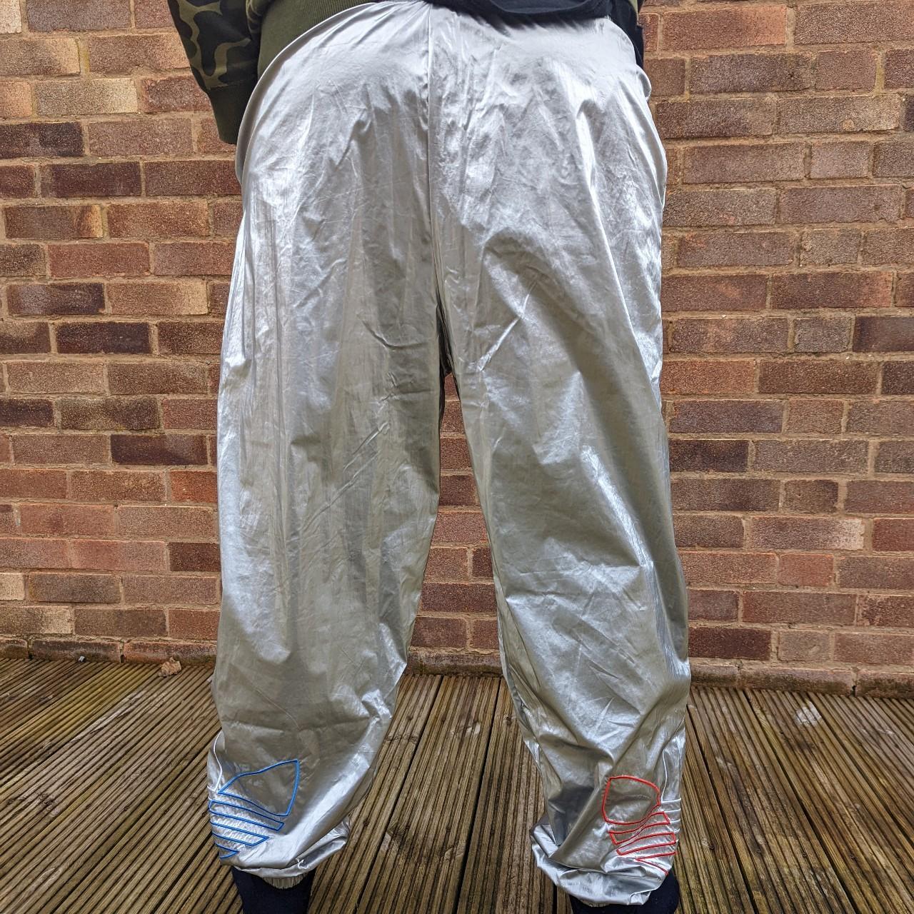 Selling these futuristic Adidas silver shiny track... - Depop