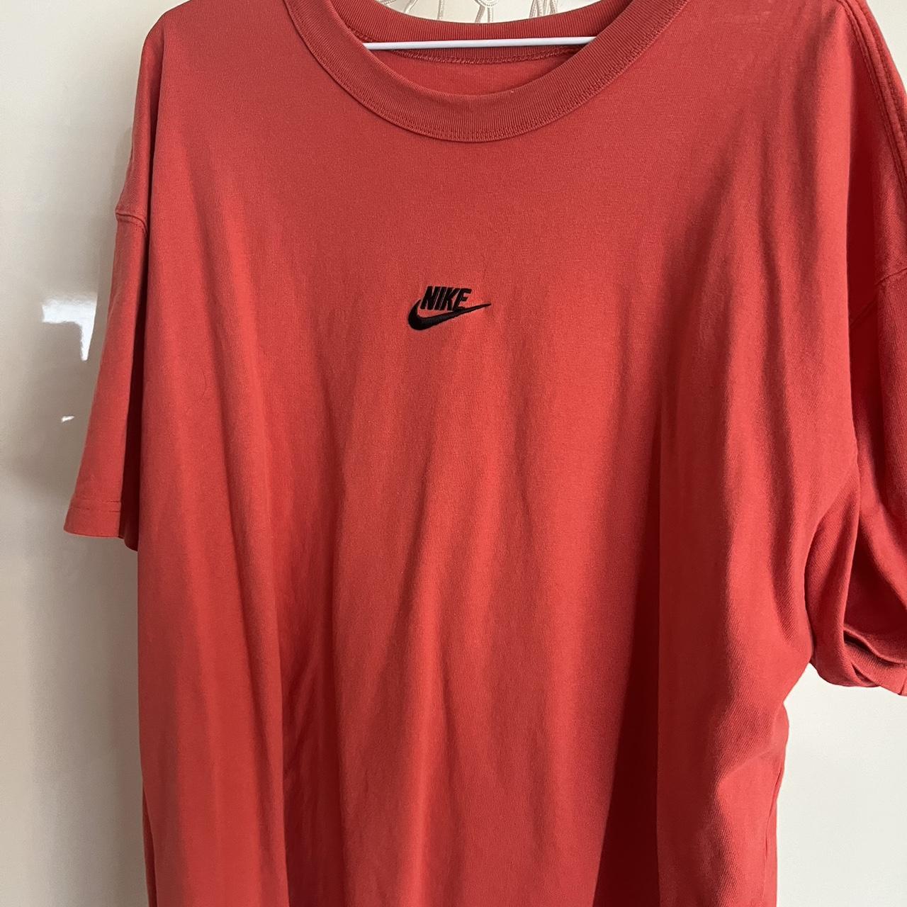 Red Nike centre swoosh tee size XL. 9/10 condition,... - Depop