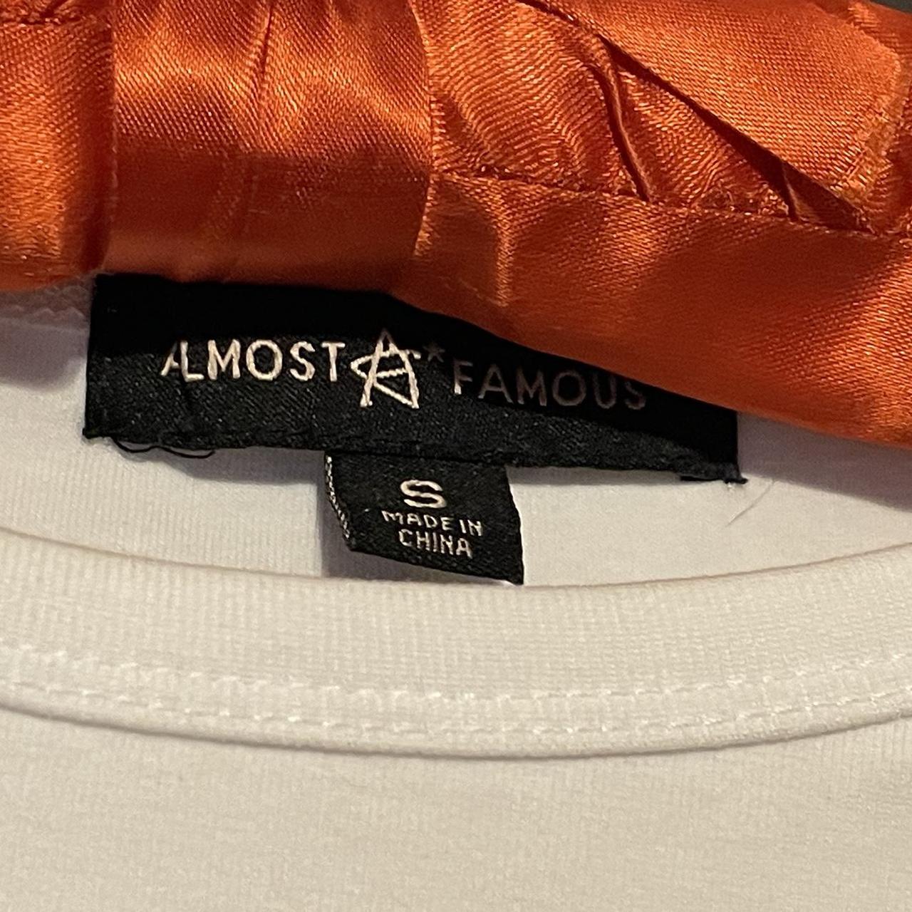 almost famous tee w fishnet sleeves - Depop