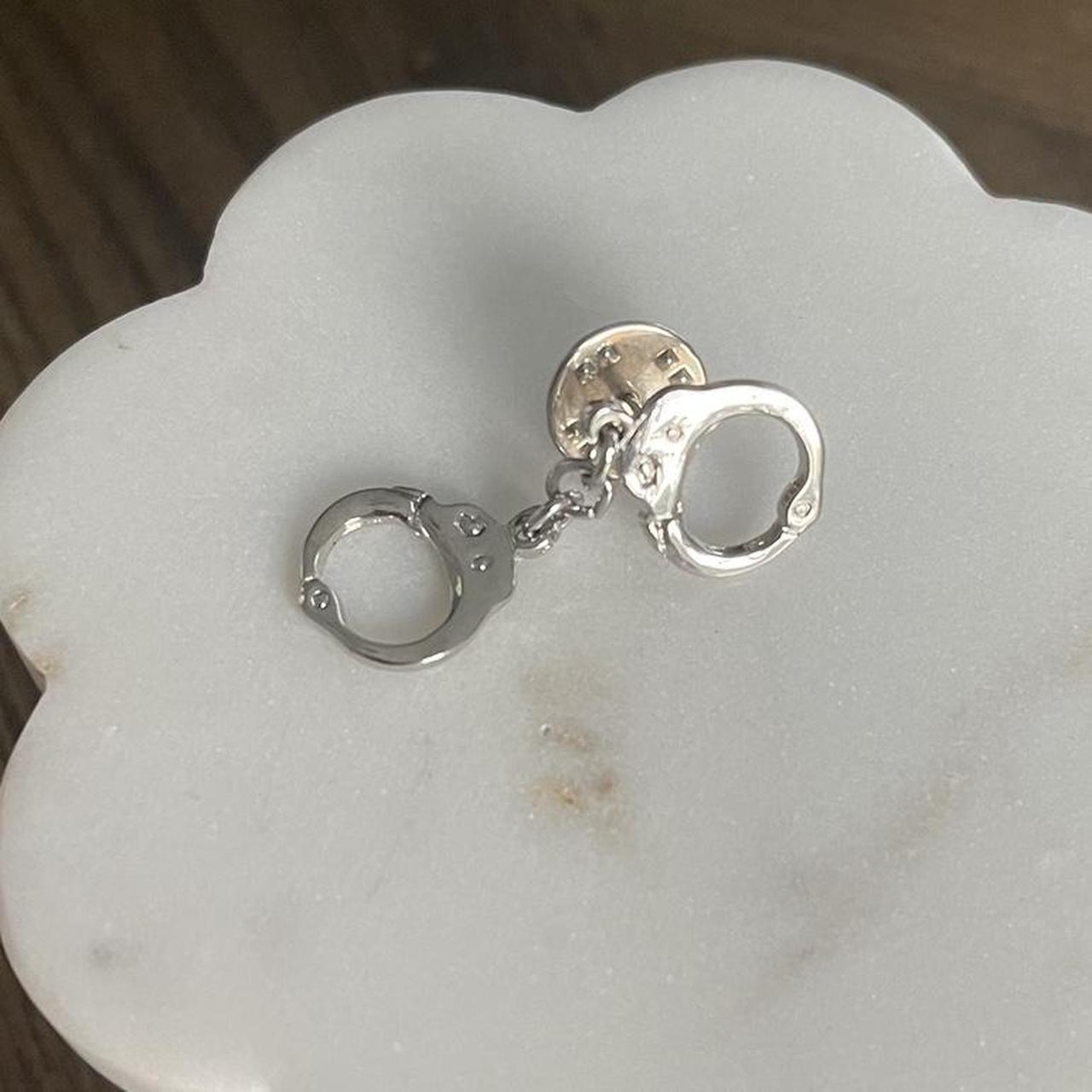 Silver Toned Handcuff Pin •DM me with any... - Depop