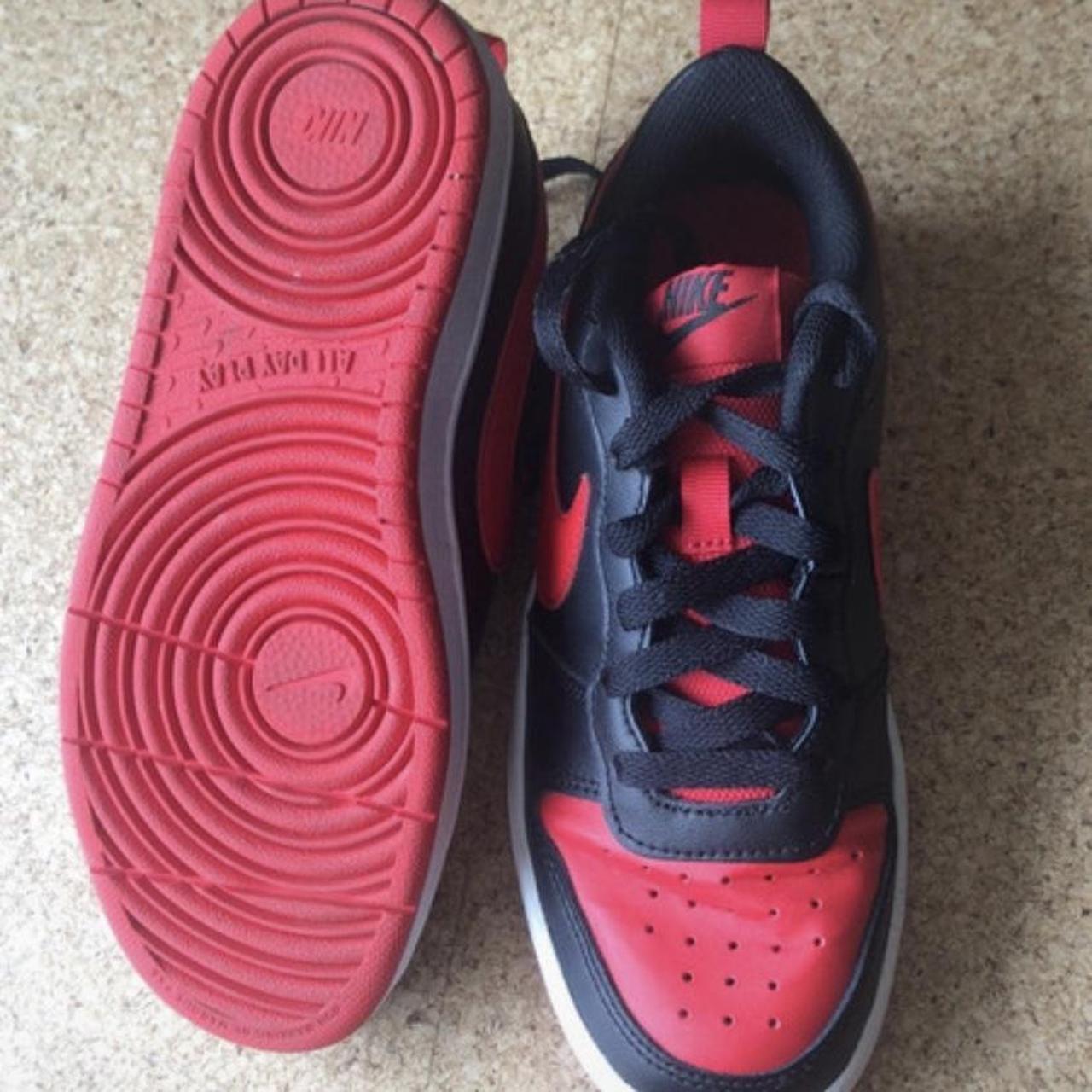 Red and black Nike trainers size 3 very good... - Depop