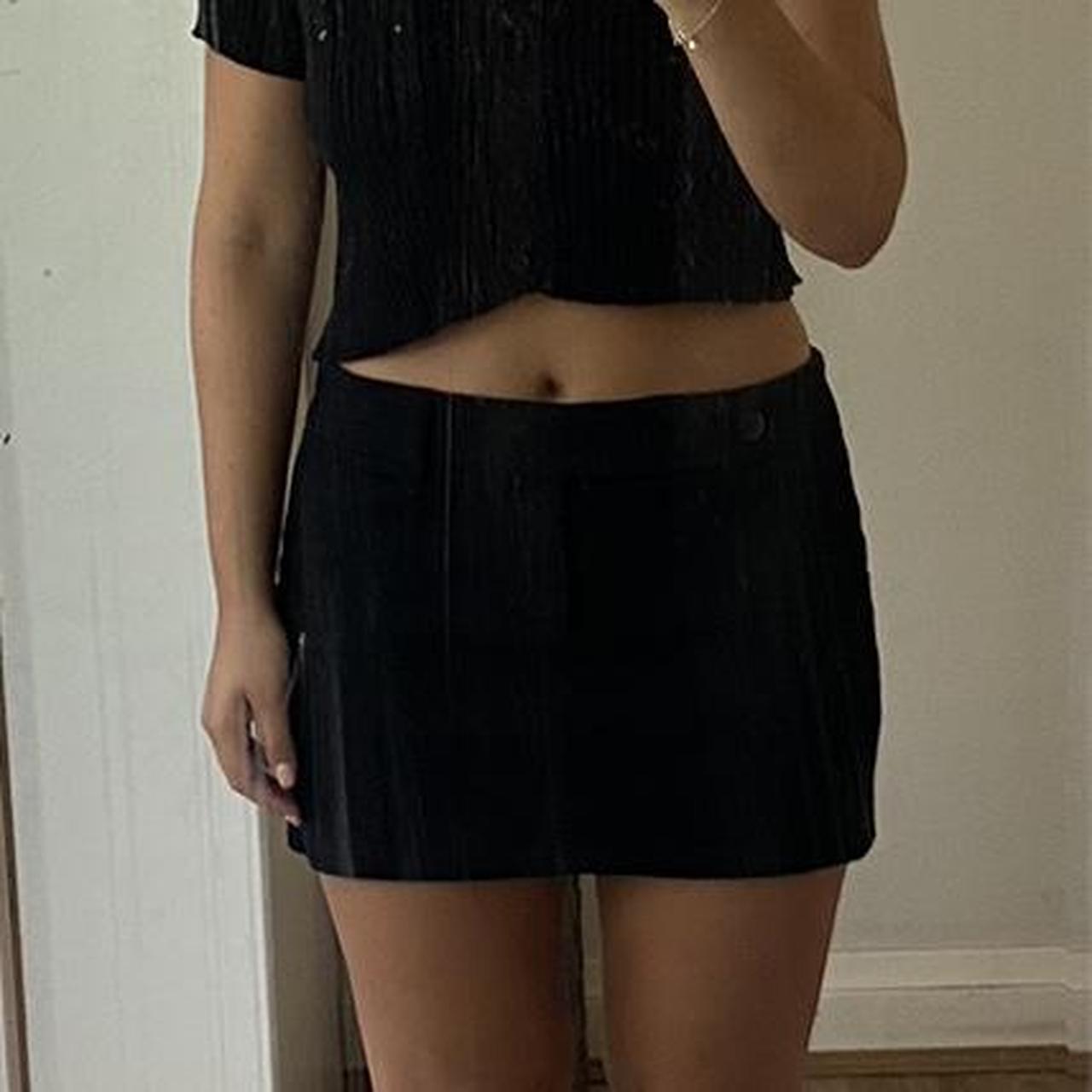 Black low rise mini skirt size 12 - Depop