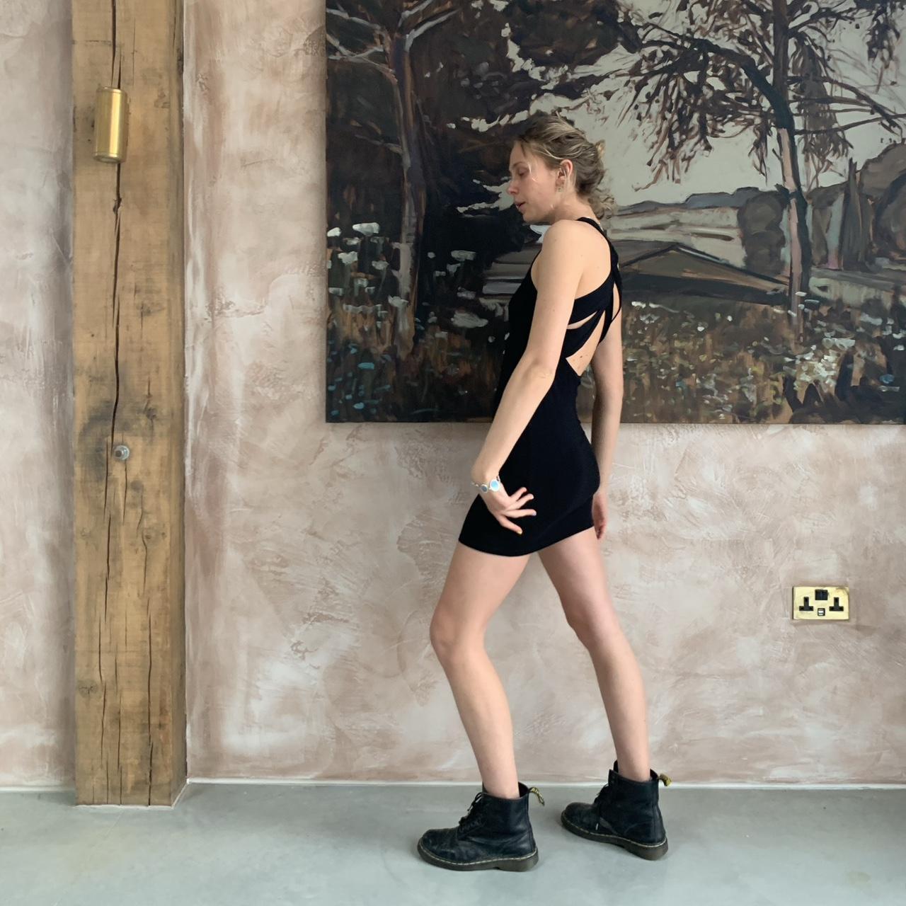 Black mini bodycon dress with cross straps on open back - Depop