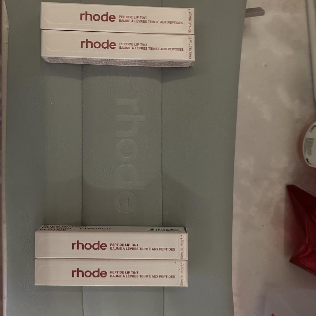 4 rhode cinnamon roll lip tints + Rhode puffer... - Depop