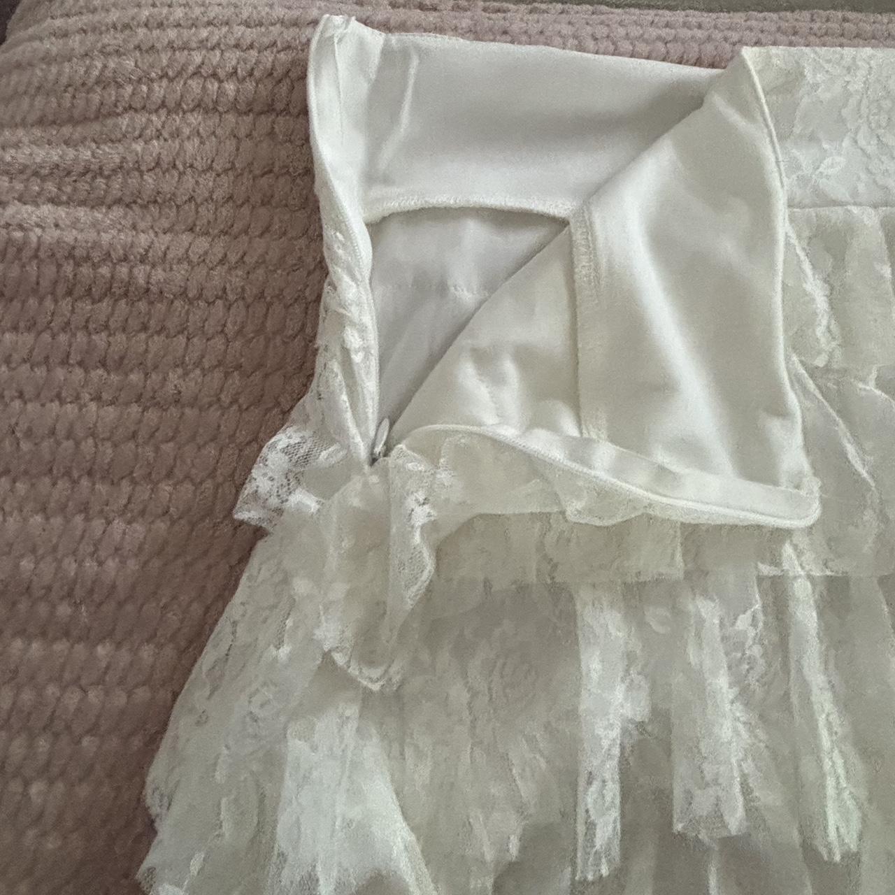 White lace ruffle mini skirt with zipper on the side... - Depop