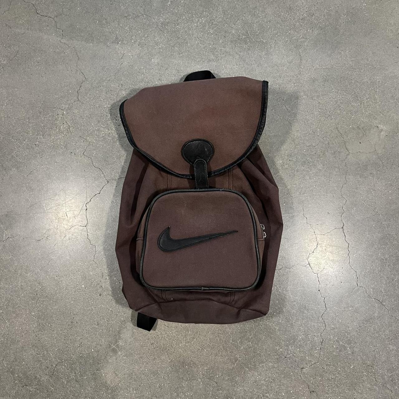 1990s brown Nike back pack. Can fit a basketball and... - Depop