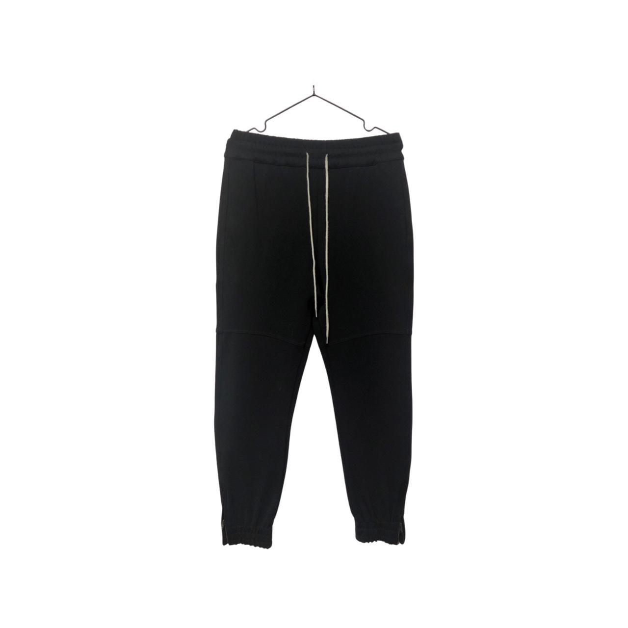 Black Bassike sweatpants with zippers at the bottom... - Depop