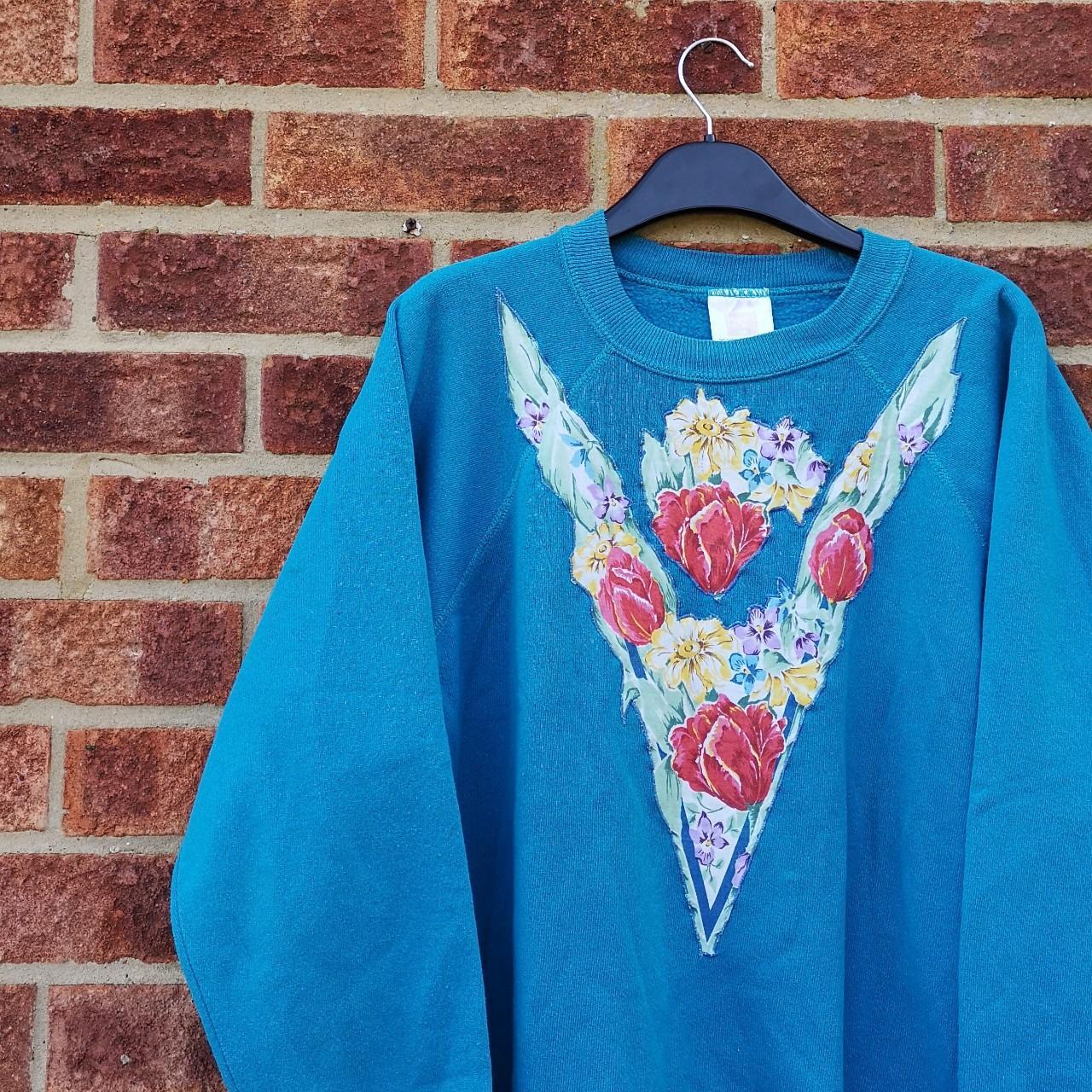 Vintage blue sweater with floral design stitched on... - Depop