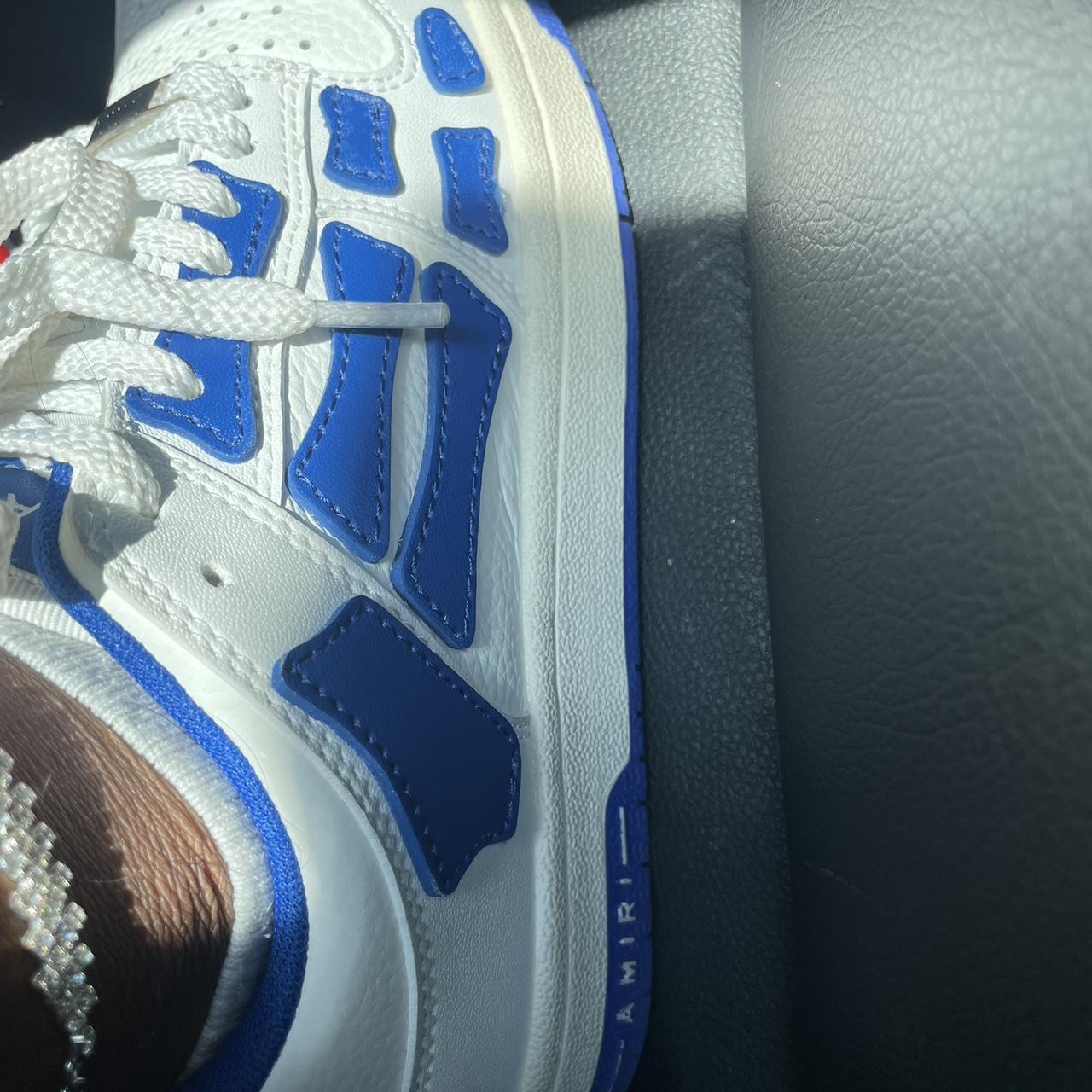 amiris low white and blue trainers, only worn twice,... - Depop