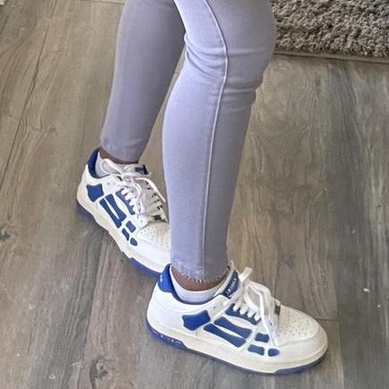 amiris low white and blue trainers, only worn twice,... - Depop