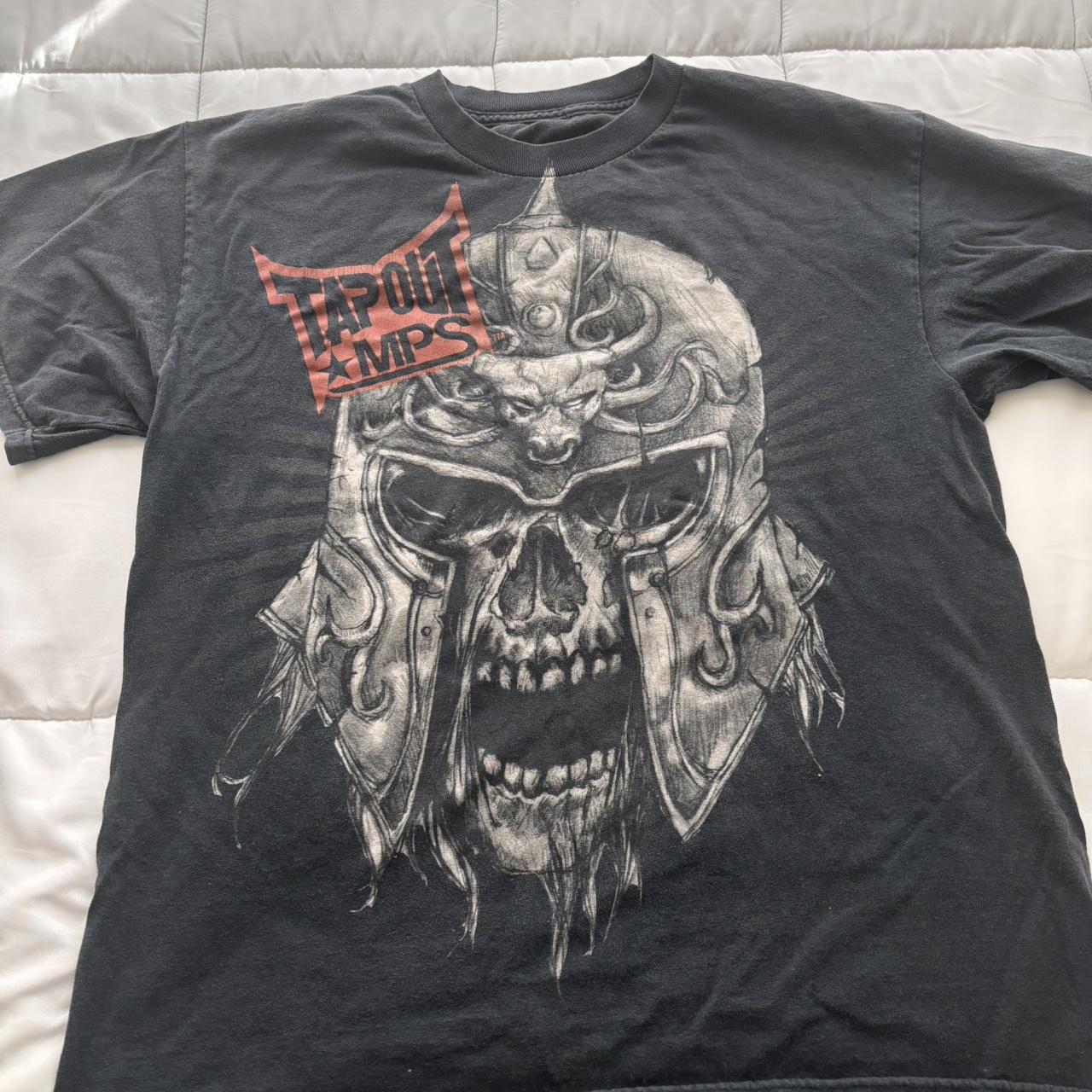 Black Tapout tee with skull design It says size... - Depop
