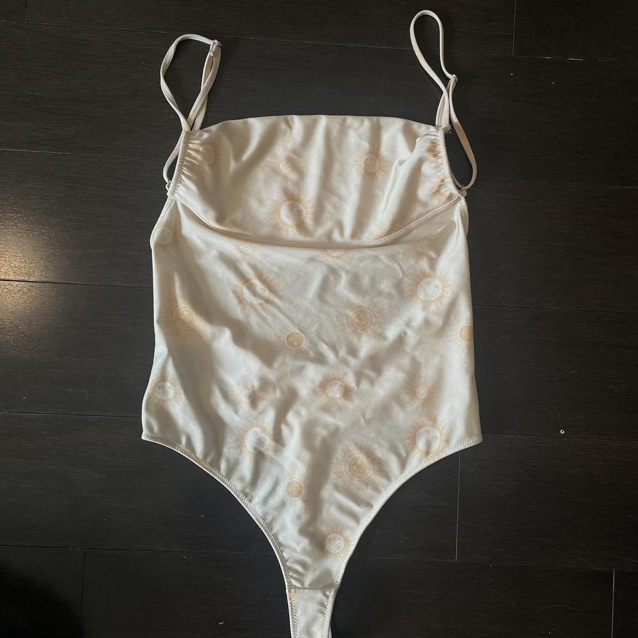 adorable celestial backless body suit bought from... - Depop