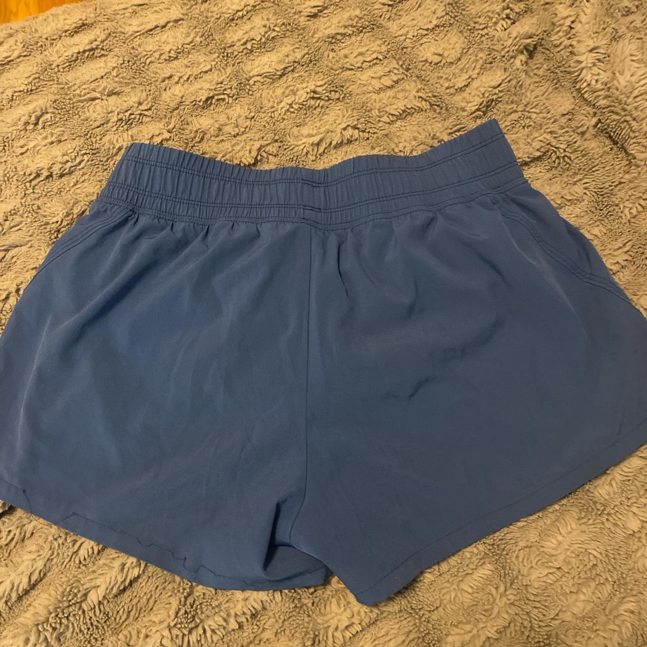Blue workout shorts from gap with built in... - Depop
