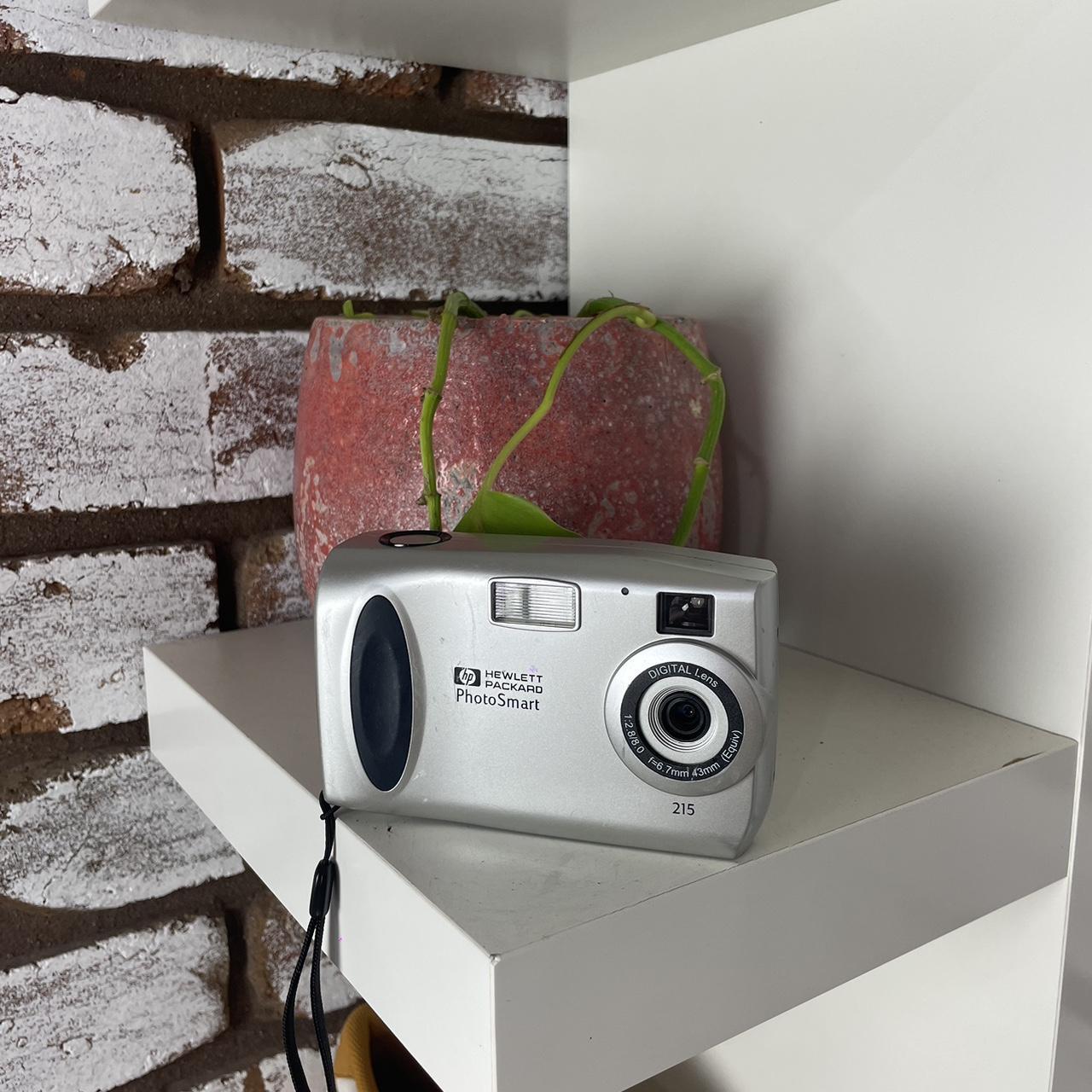 H P. Vintage point and shoot digital camera with... - Depop