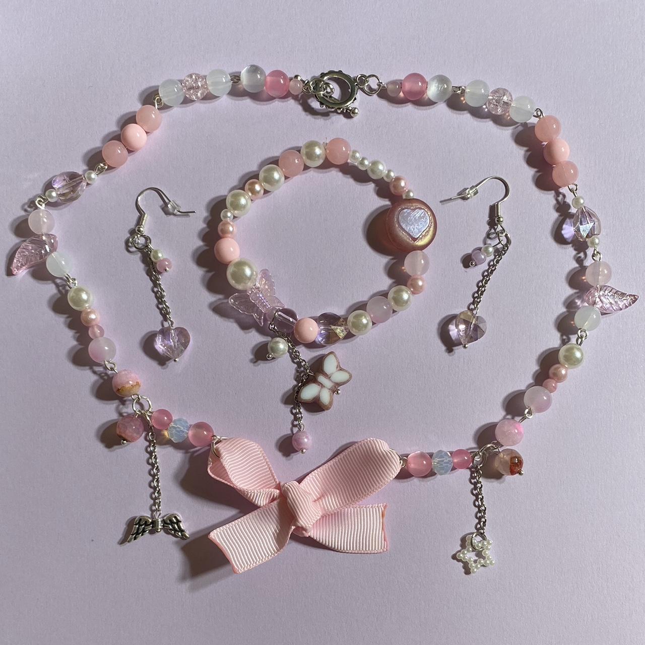 Pink bow jewlery set ! Comes with bracelet earrings... - Depop