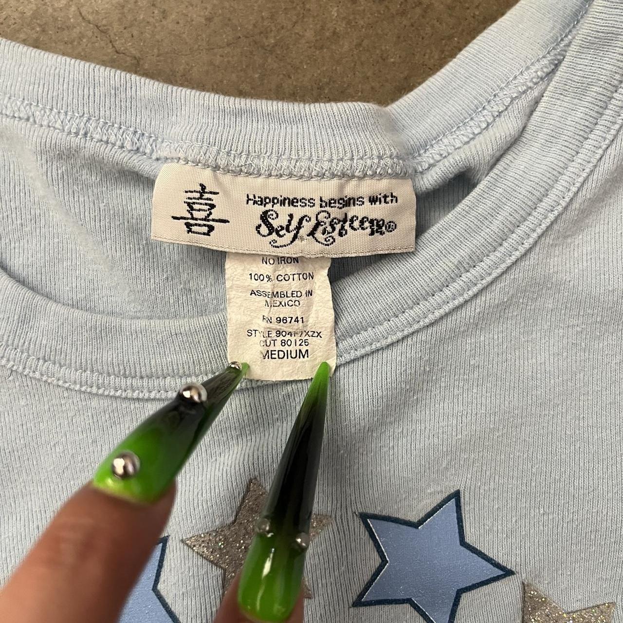 Light Blue Graphic Tee with Stars and Number... | Depop