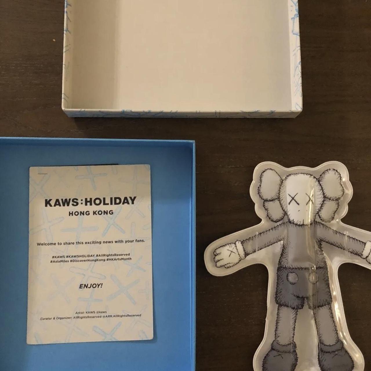 KAWS. (American. b. 1974). Rare. 'Holiday: Hong... - Depop