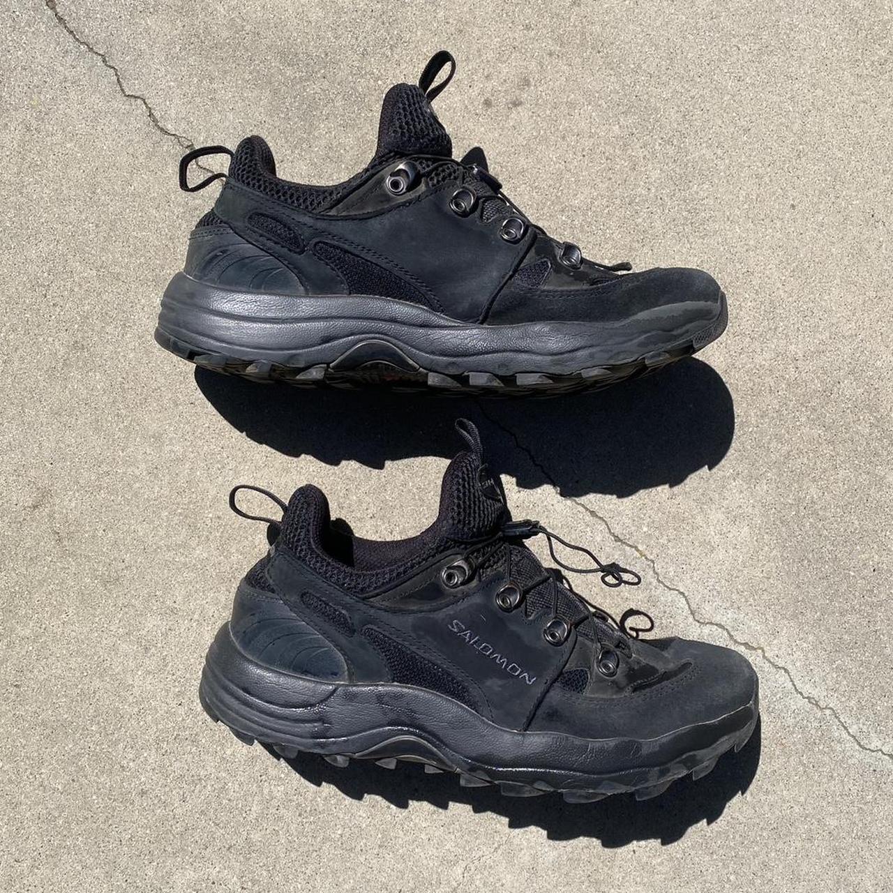 Black Salomon hiking shoes - Depop