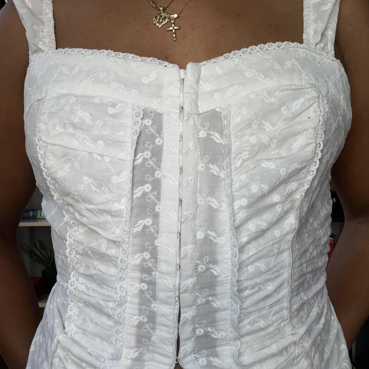 XOXO white Bustier with lacy flower accents and... - Depop