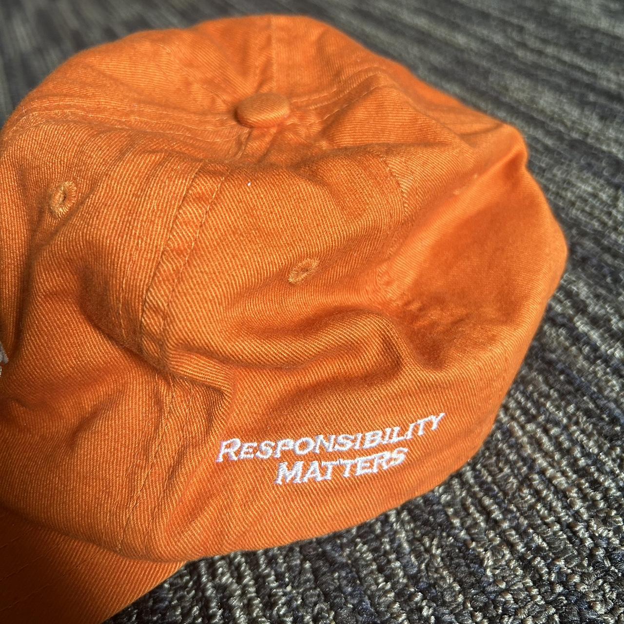 Orange bud, light strap, back hat - Depop